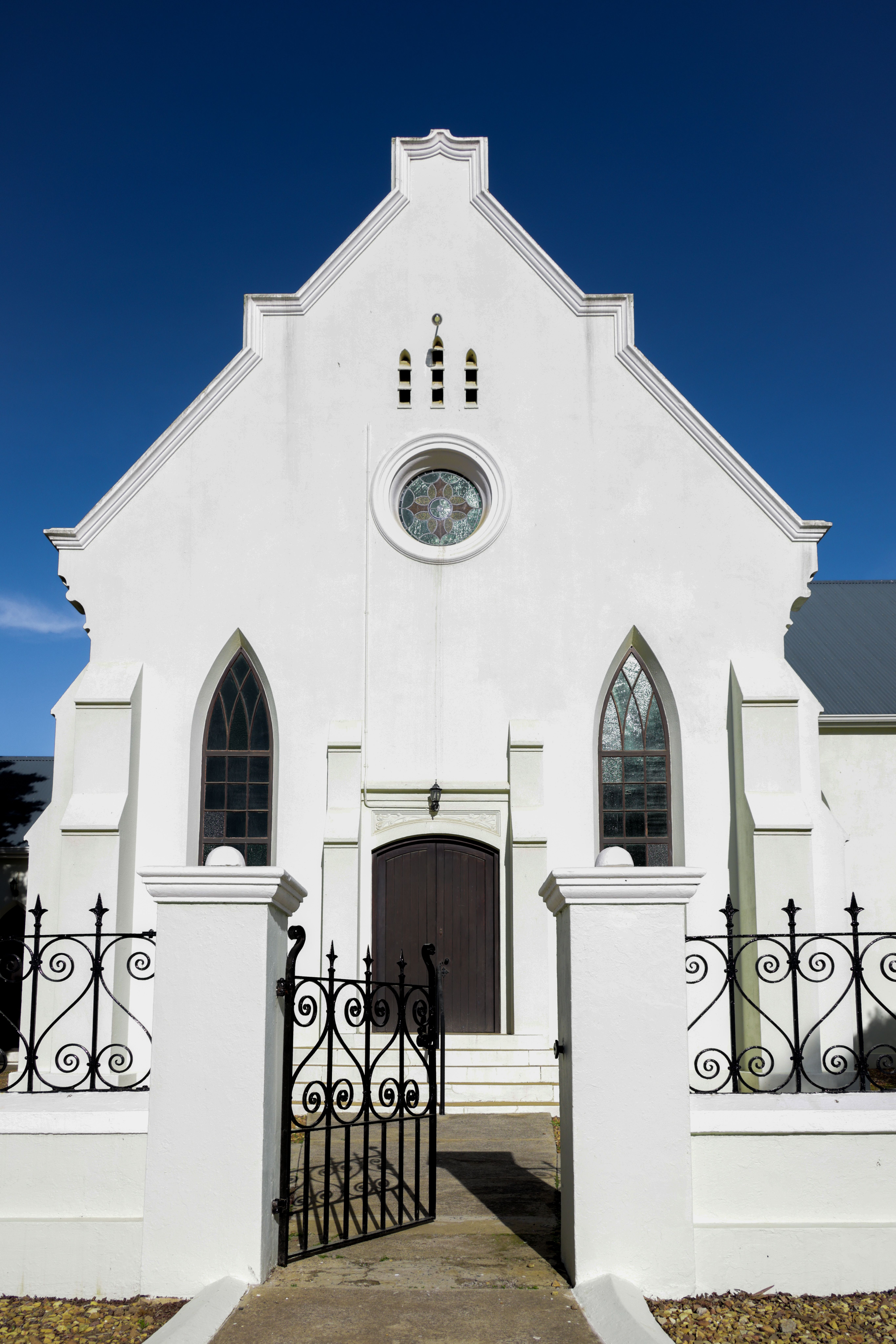 Charming White Church with Gothic Architecture · Free Stock Photo
