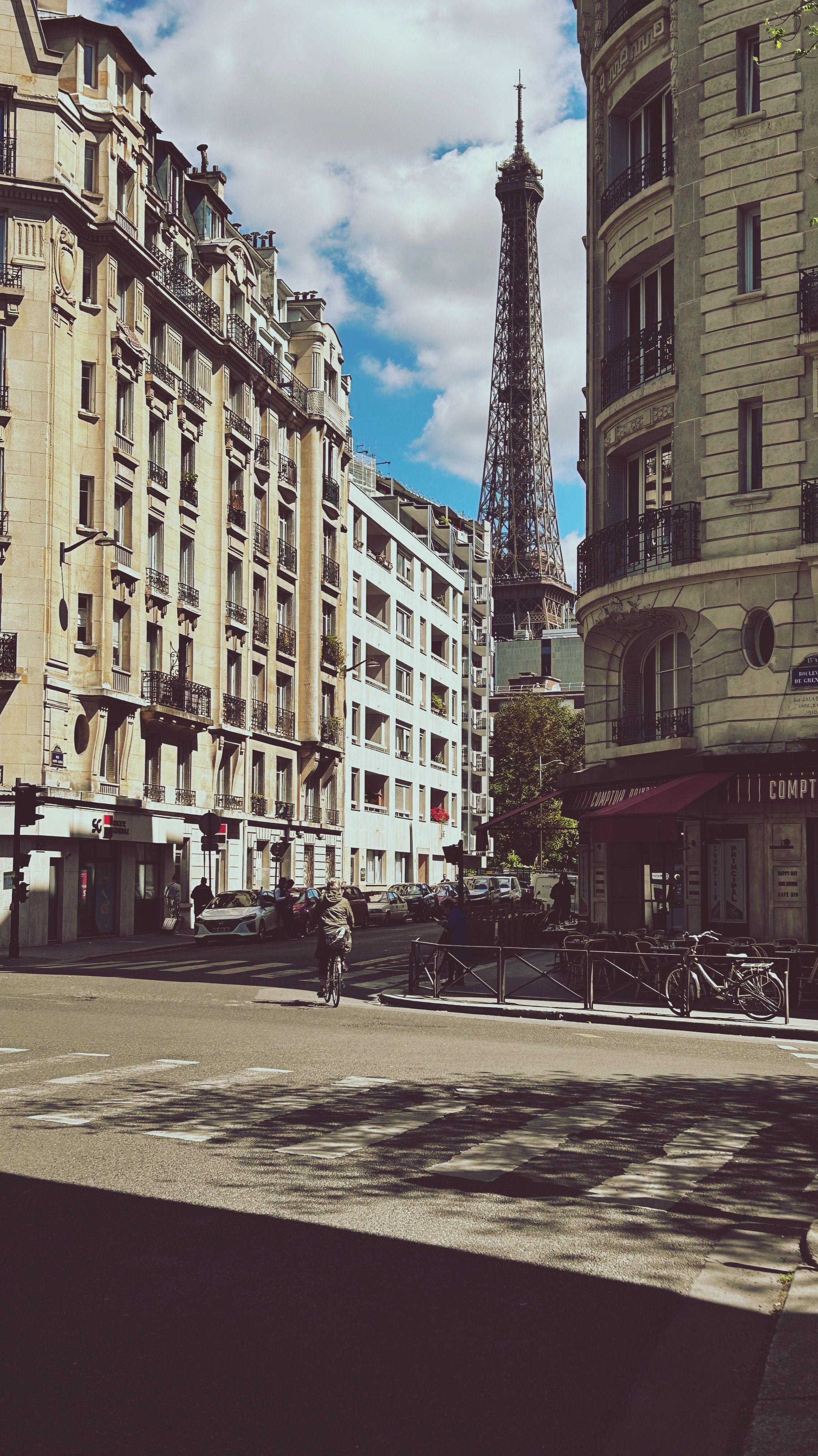 Paris Street View with Eiffel Tower in Background · Free Stock Photo
