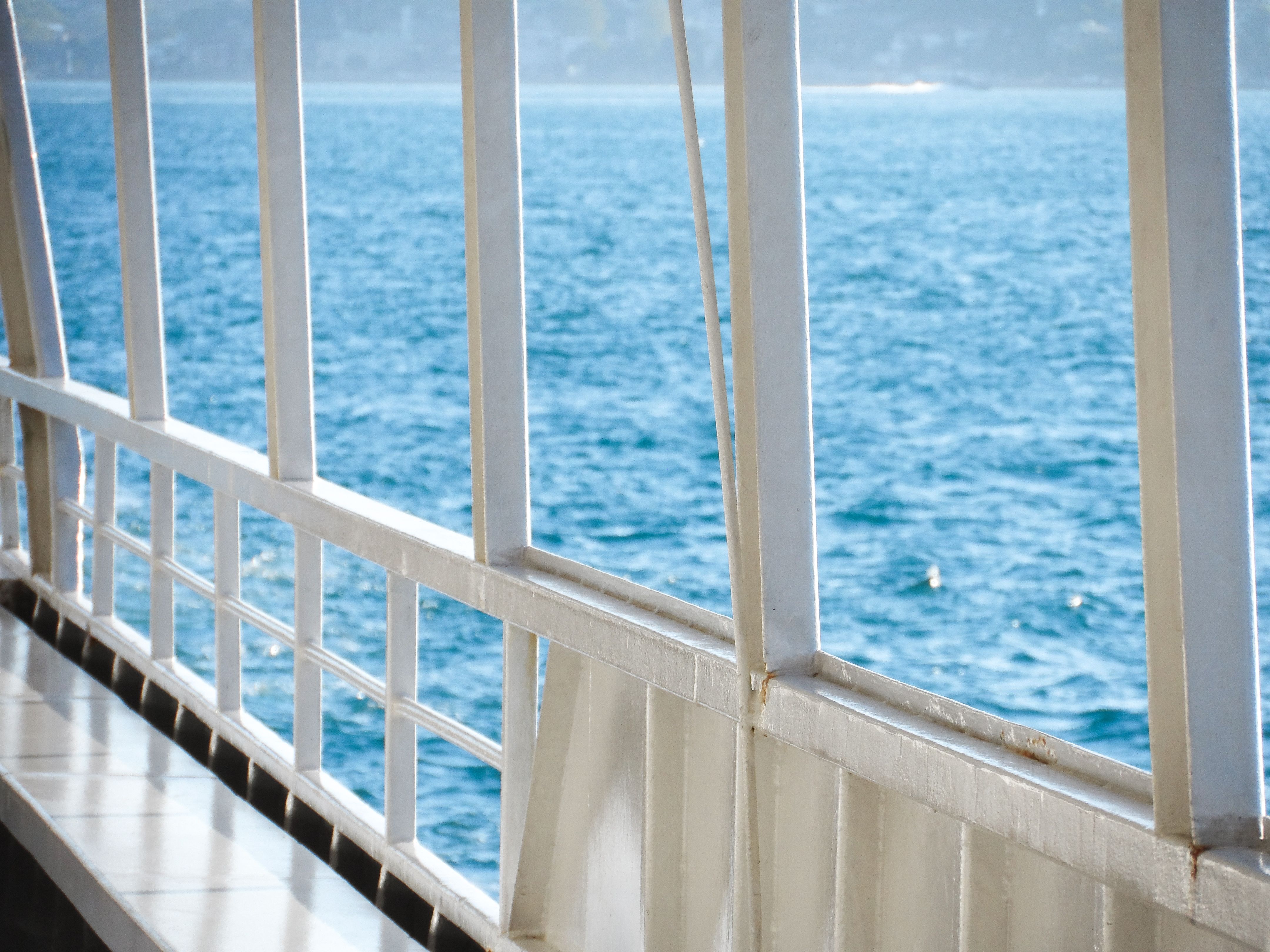 Serene Ocean View Through Ferry Railing · Free Stock Photo