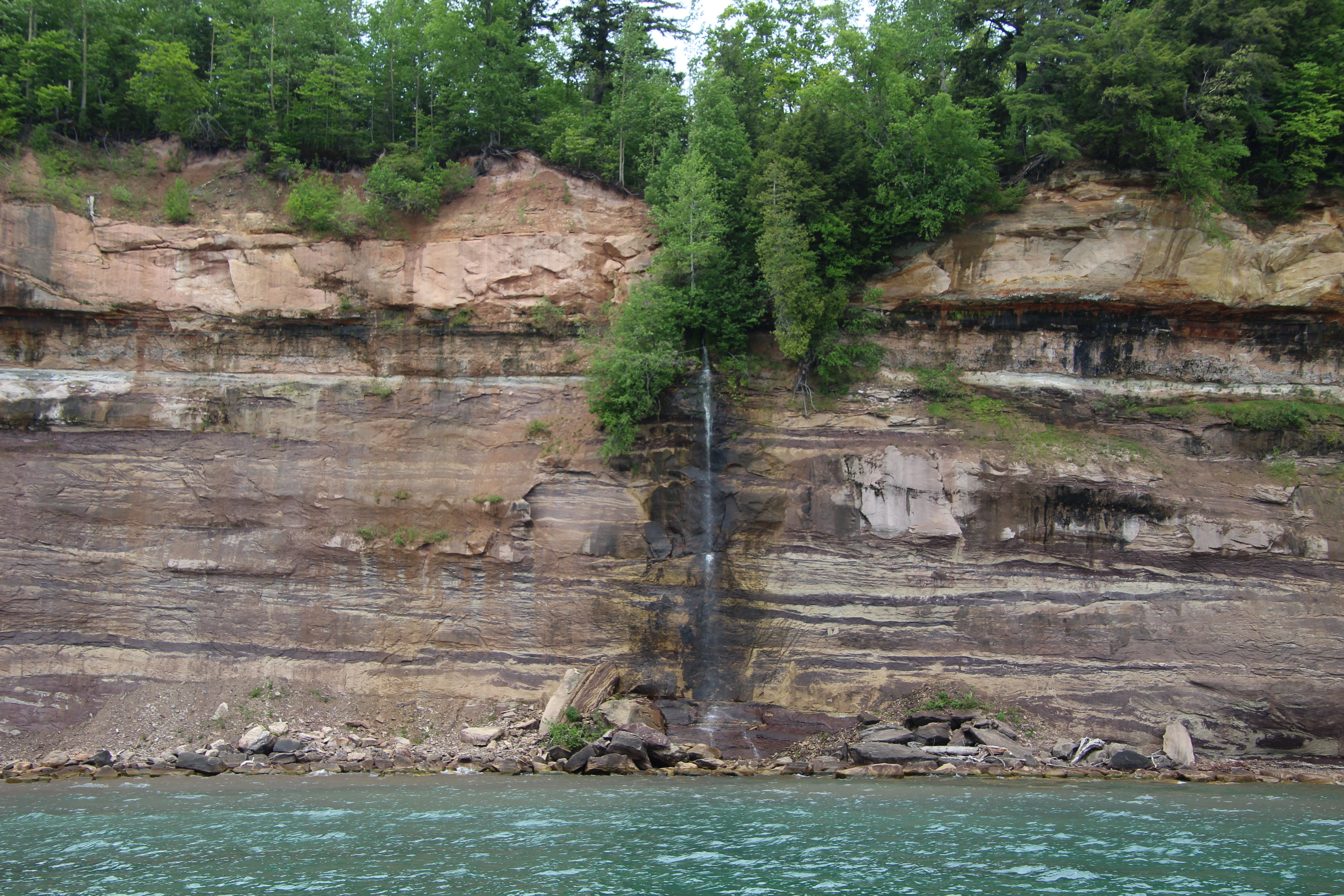 Scenic View of Pictured Rocks Cliffs and Waterfall · Free Stock Photo