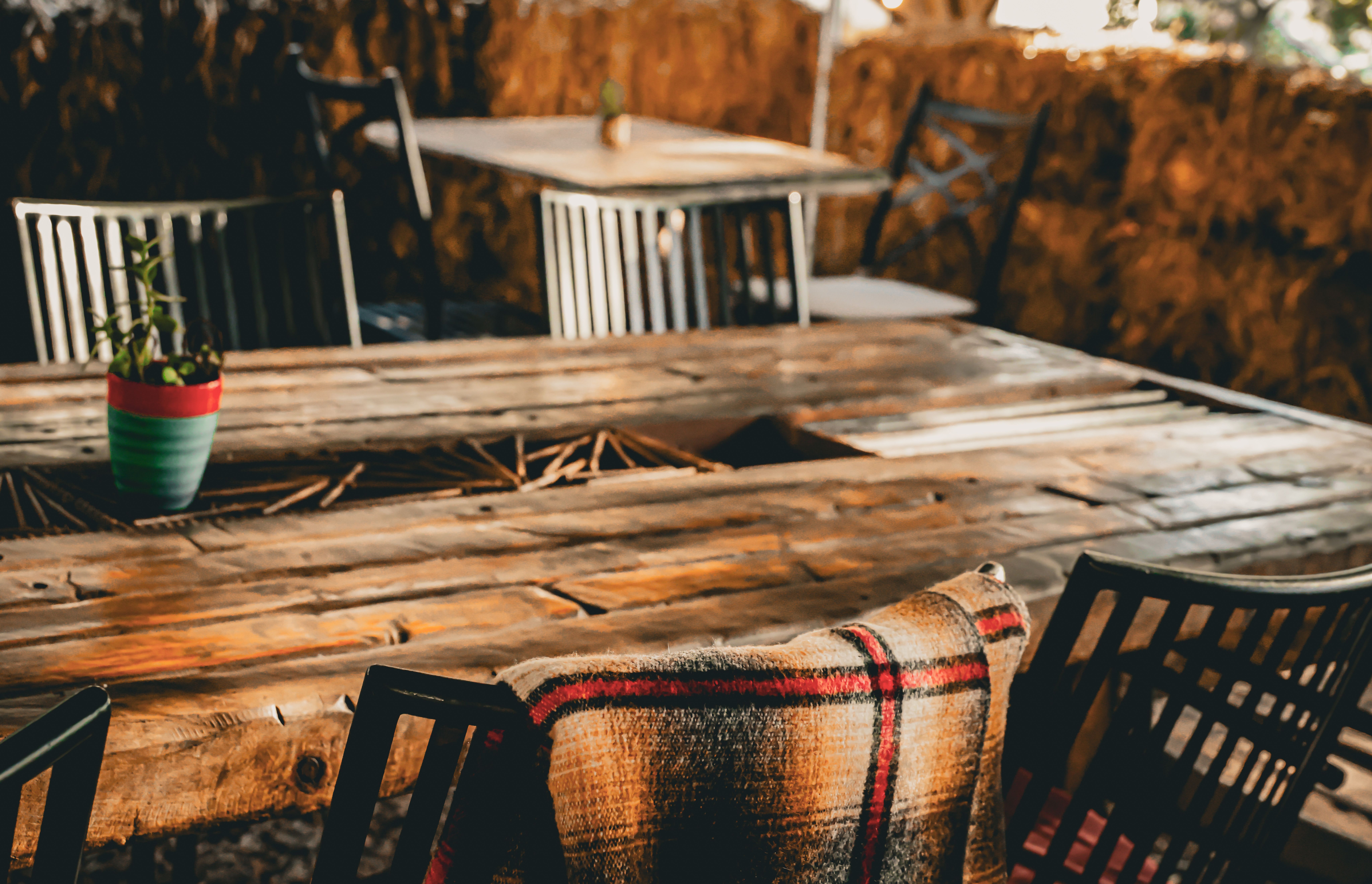 Cozy Outdoor Seating at Rustic Restaurant · Free Stock Photo