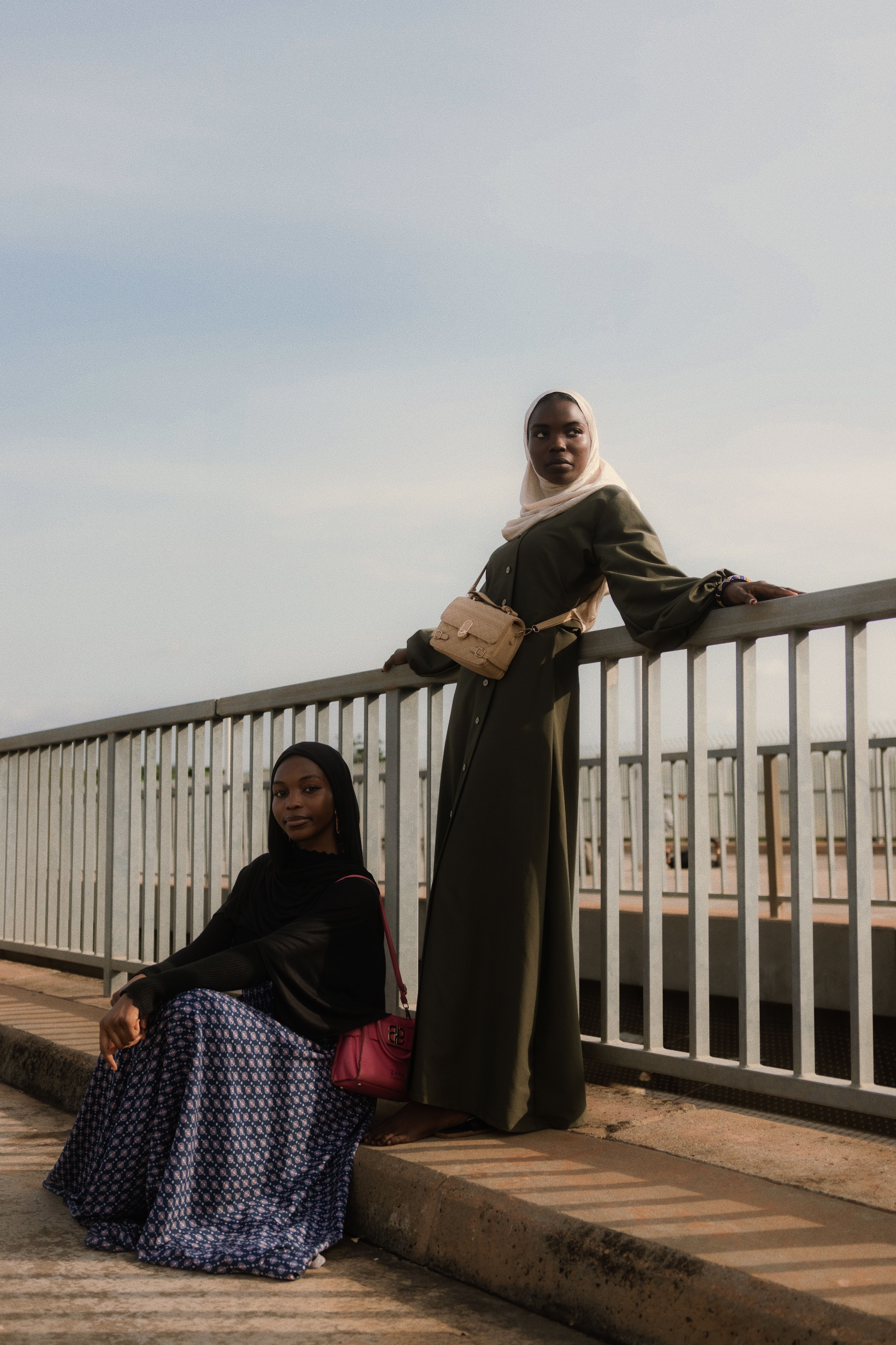 Stylish Women Posing on Abuja Bridge · Free Stock Photo