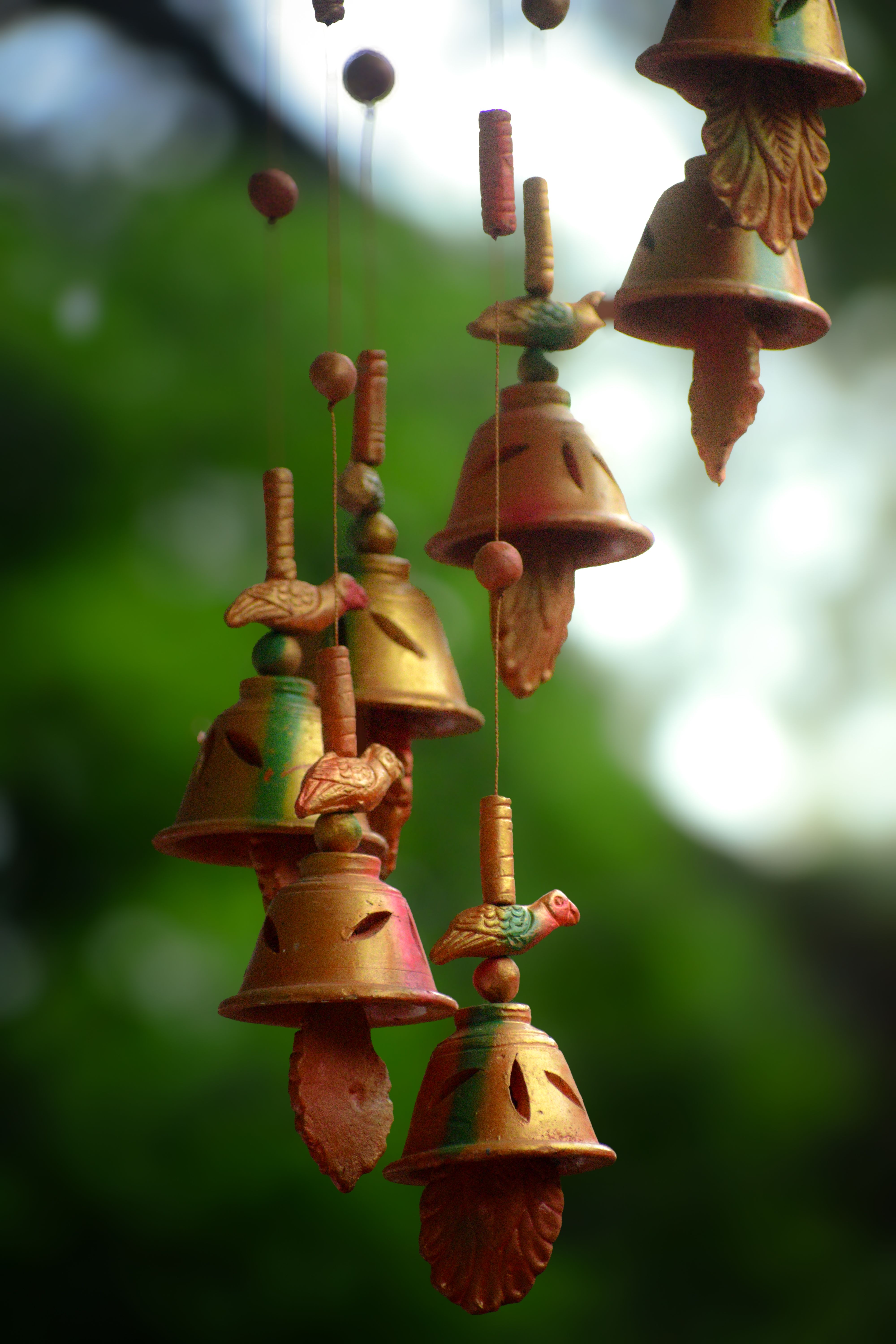 Close-up of Decorative Hanging Bells Outdoors · Free Stock Photo