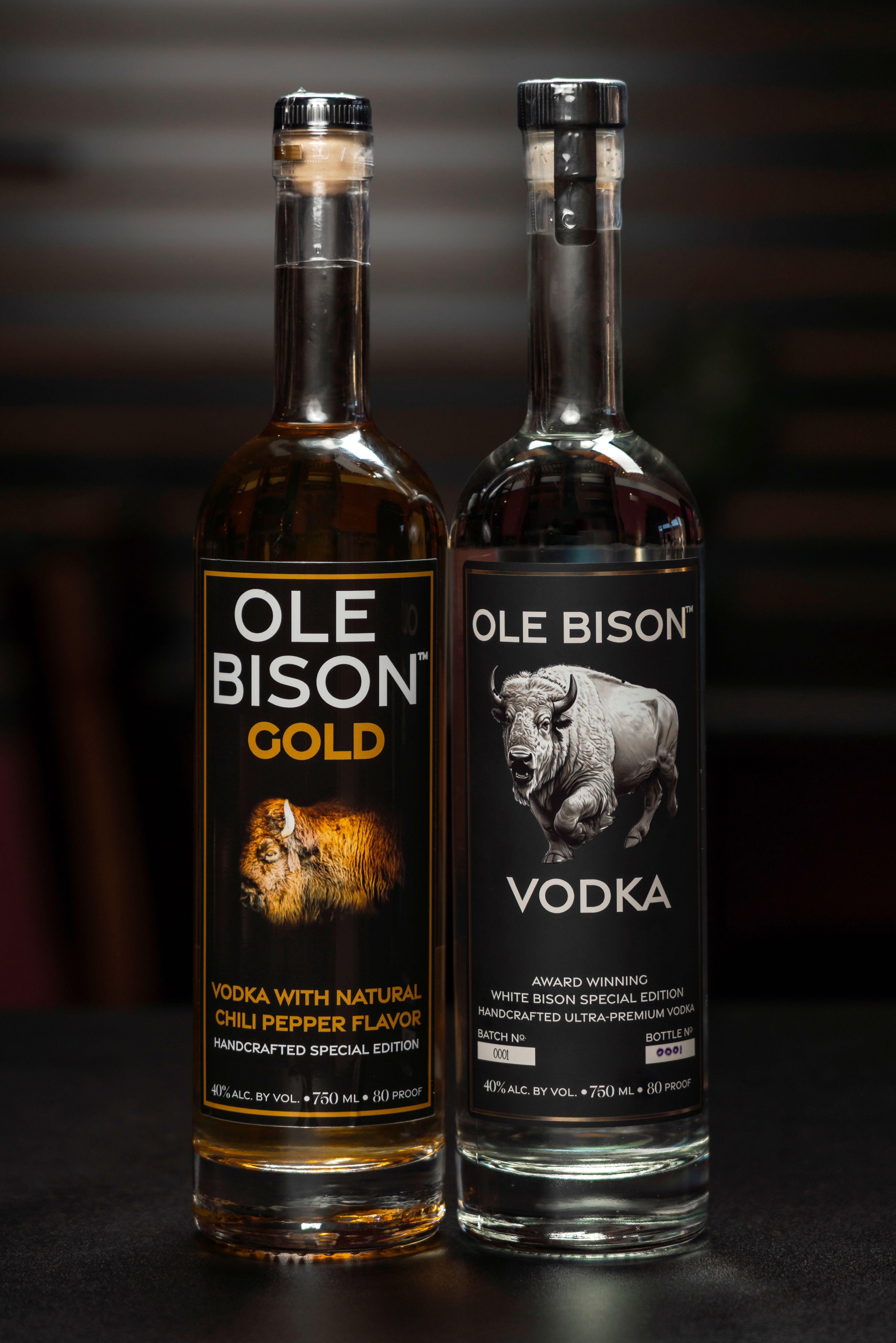 Ole Bison Vodka and Gold Bottles in Bar Setting · Free Stock Photo
