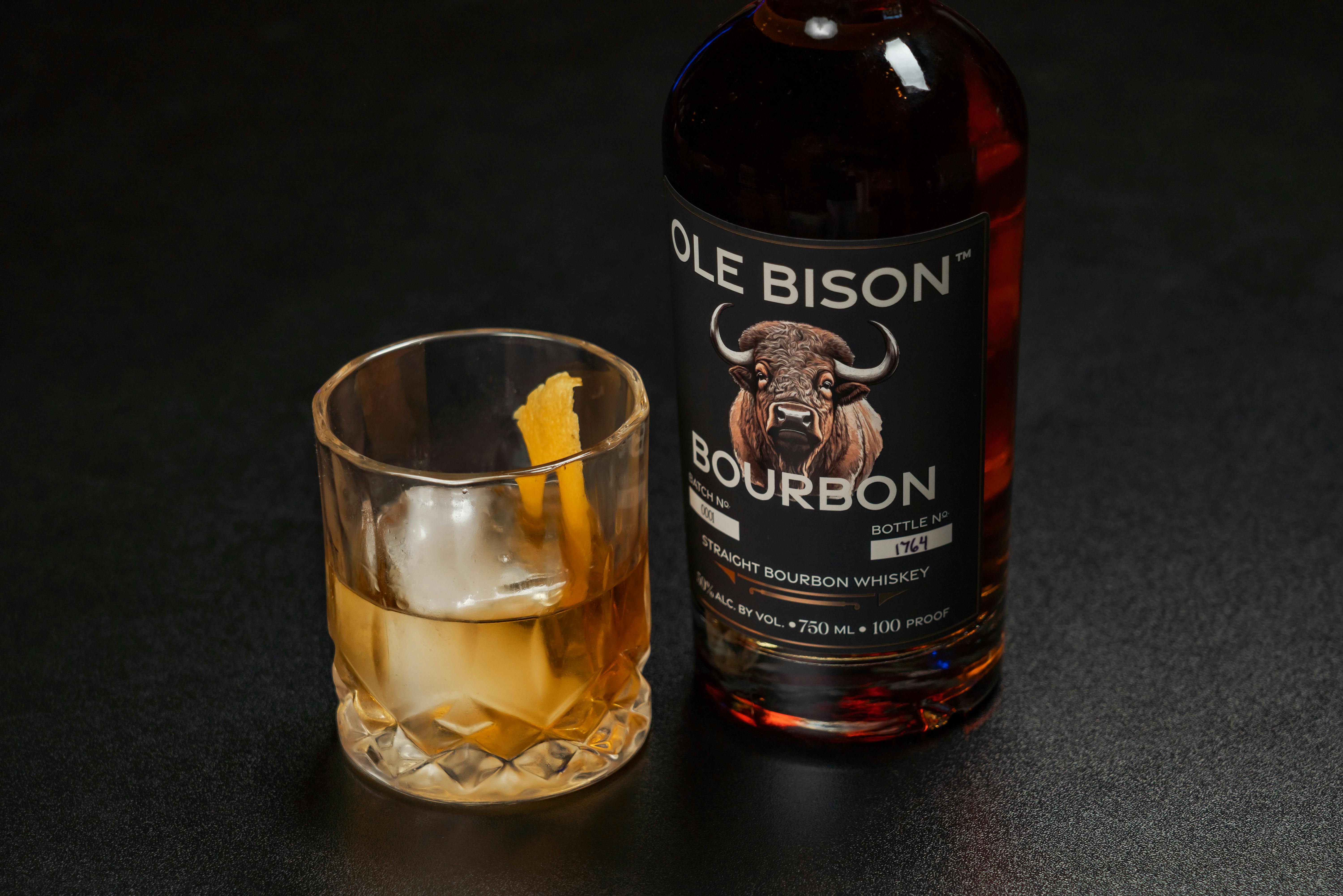 Ole Bison Bourbon with Glass of Whiskey · Free Stock Photo