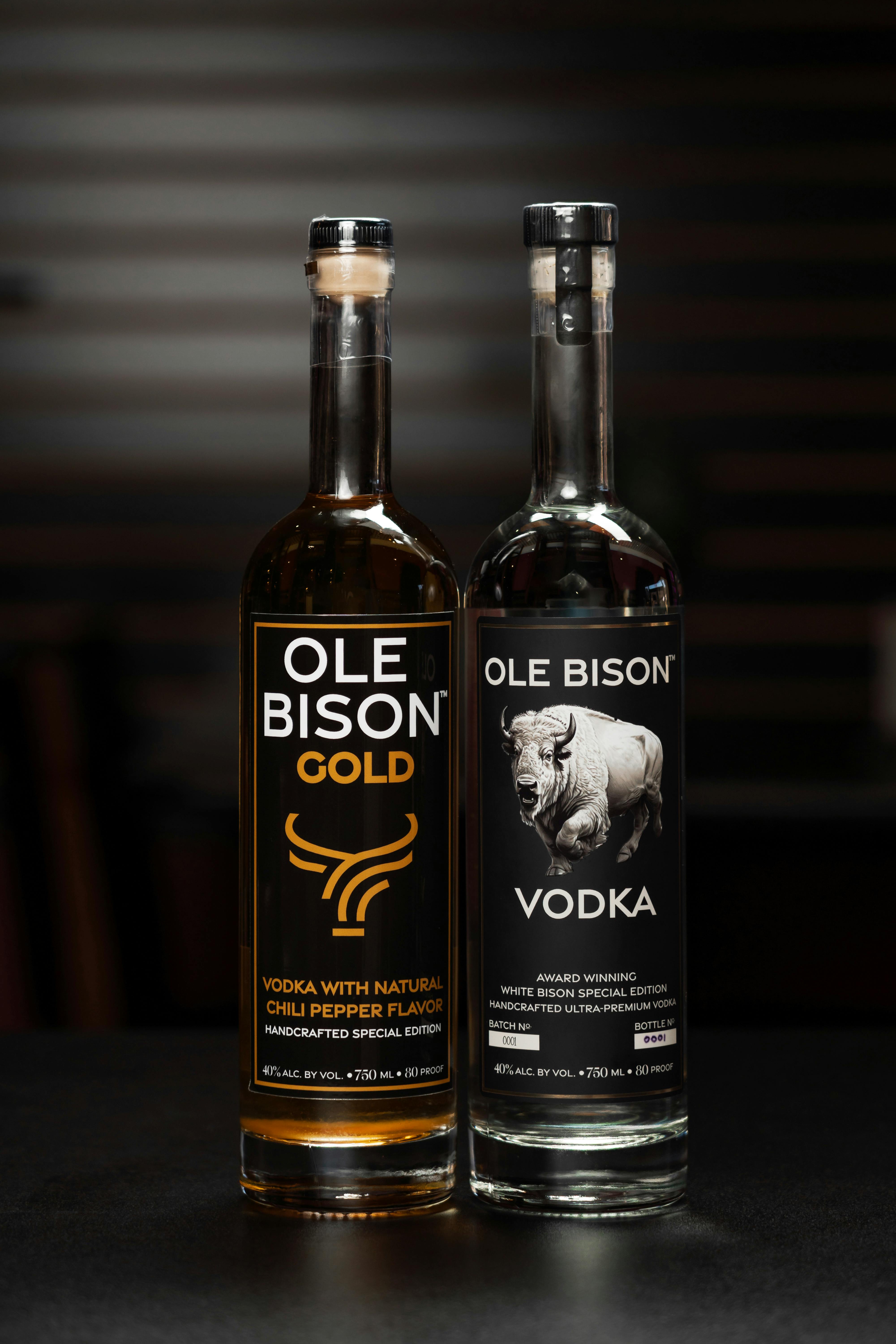 Ole Bison Vodka Bottles on Display in Bar Setting · Free Stock Photo