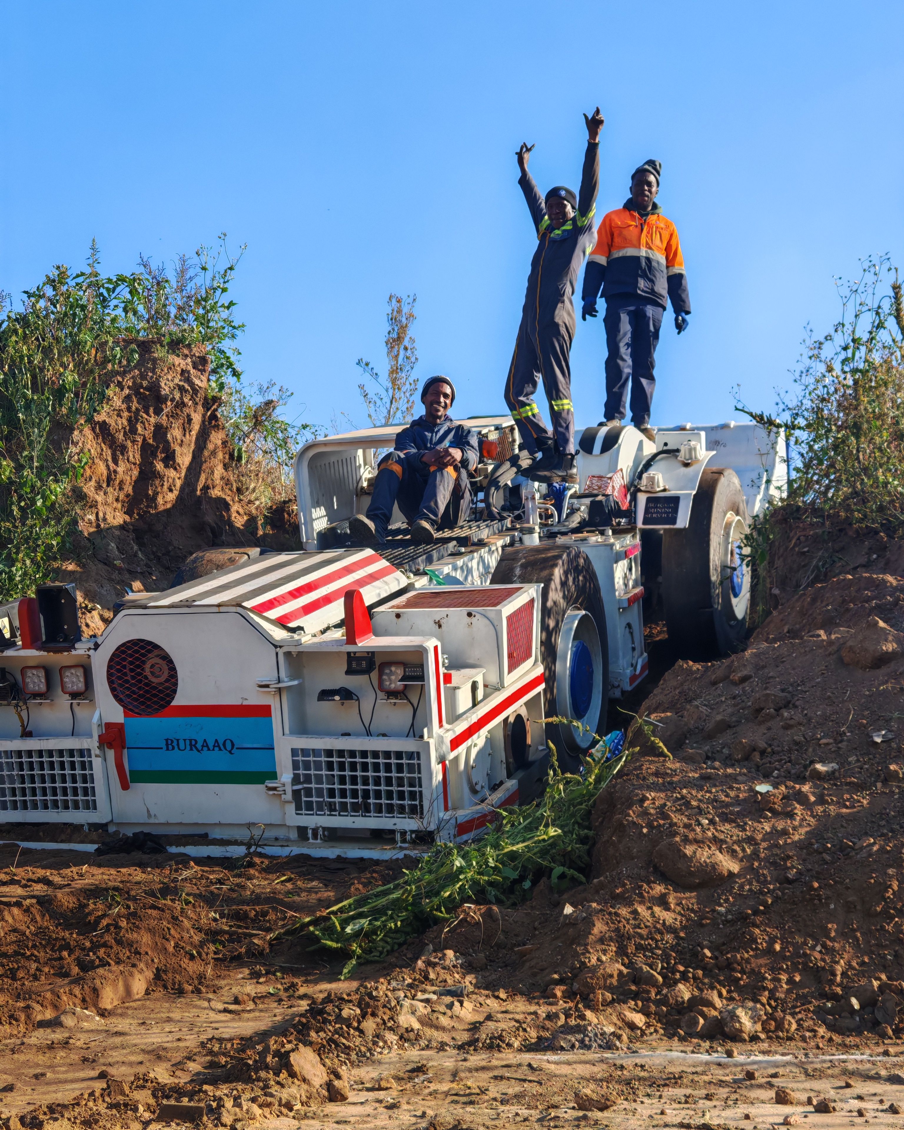 Miners Celebrating on Mining Equipment in Johannesburg · Free Stock Photo