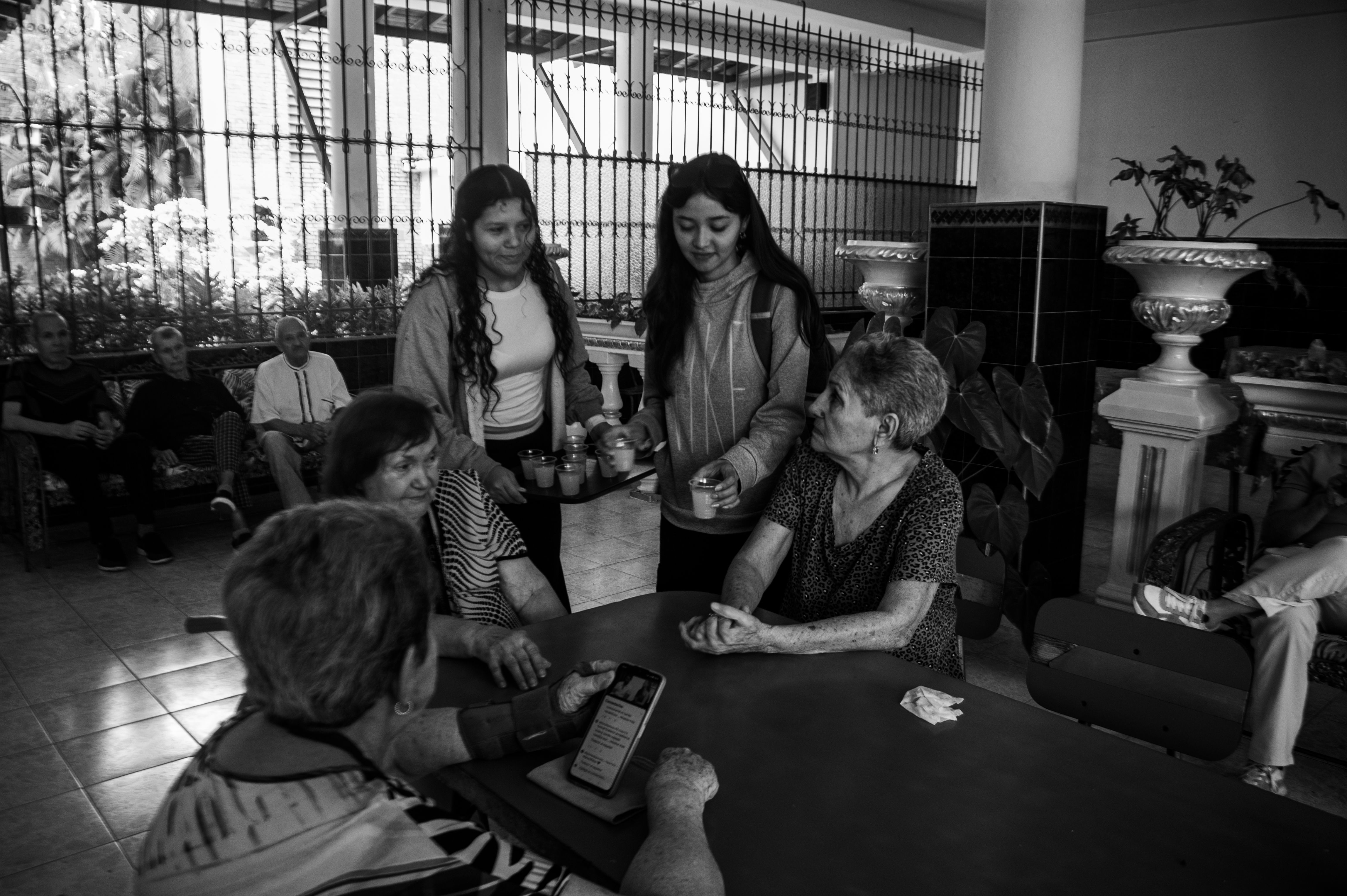 Intergenerational Gathering in Community Center · Free Stock Photo