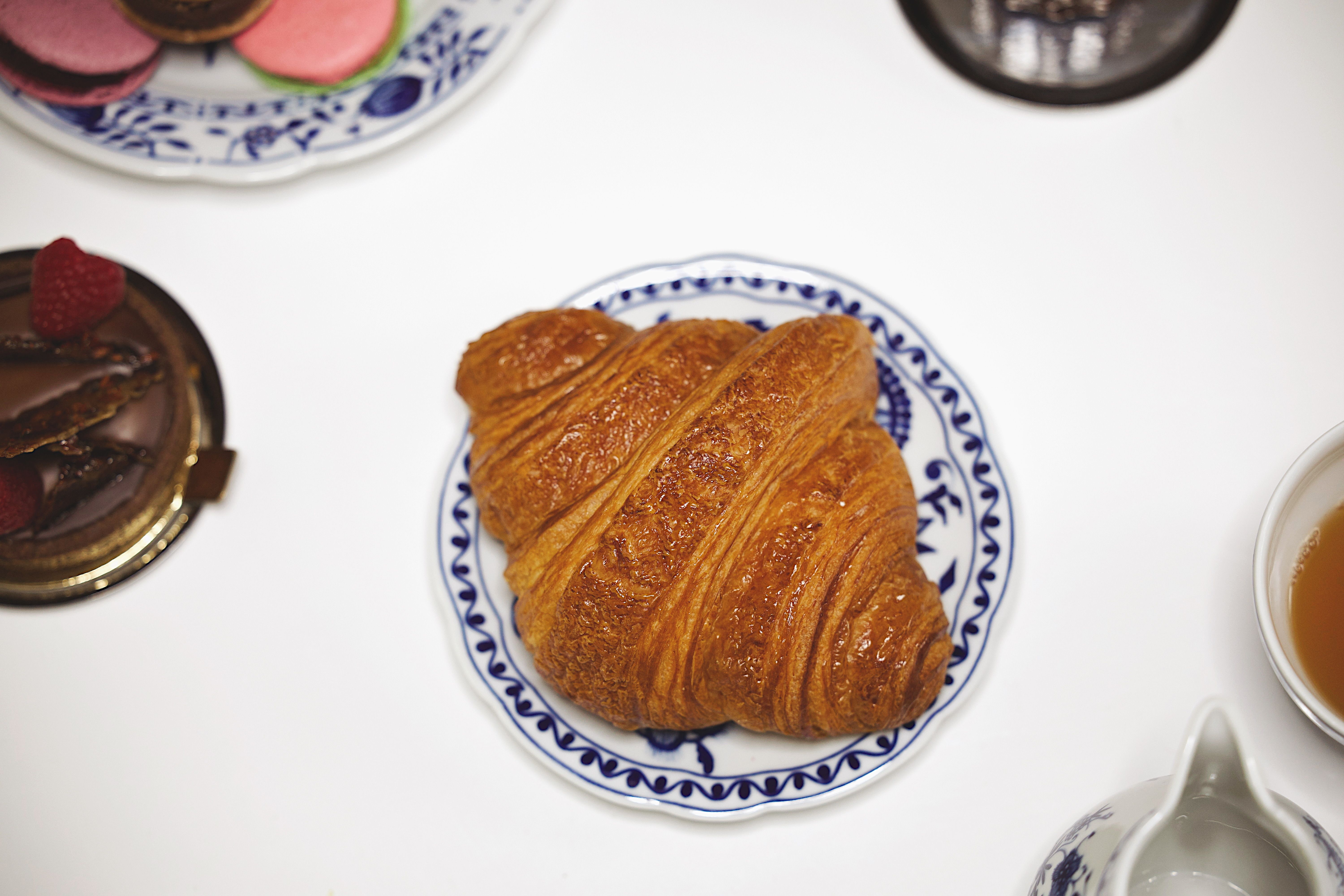 Delicious Croissant on Elegant Blue Plate · Free Stock Photo