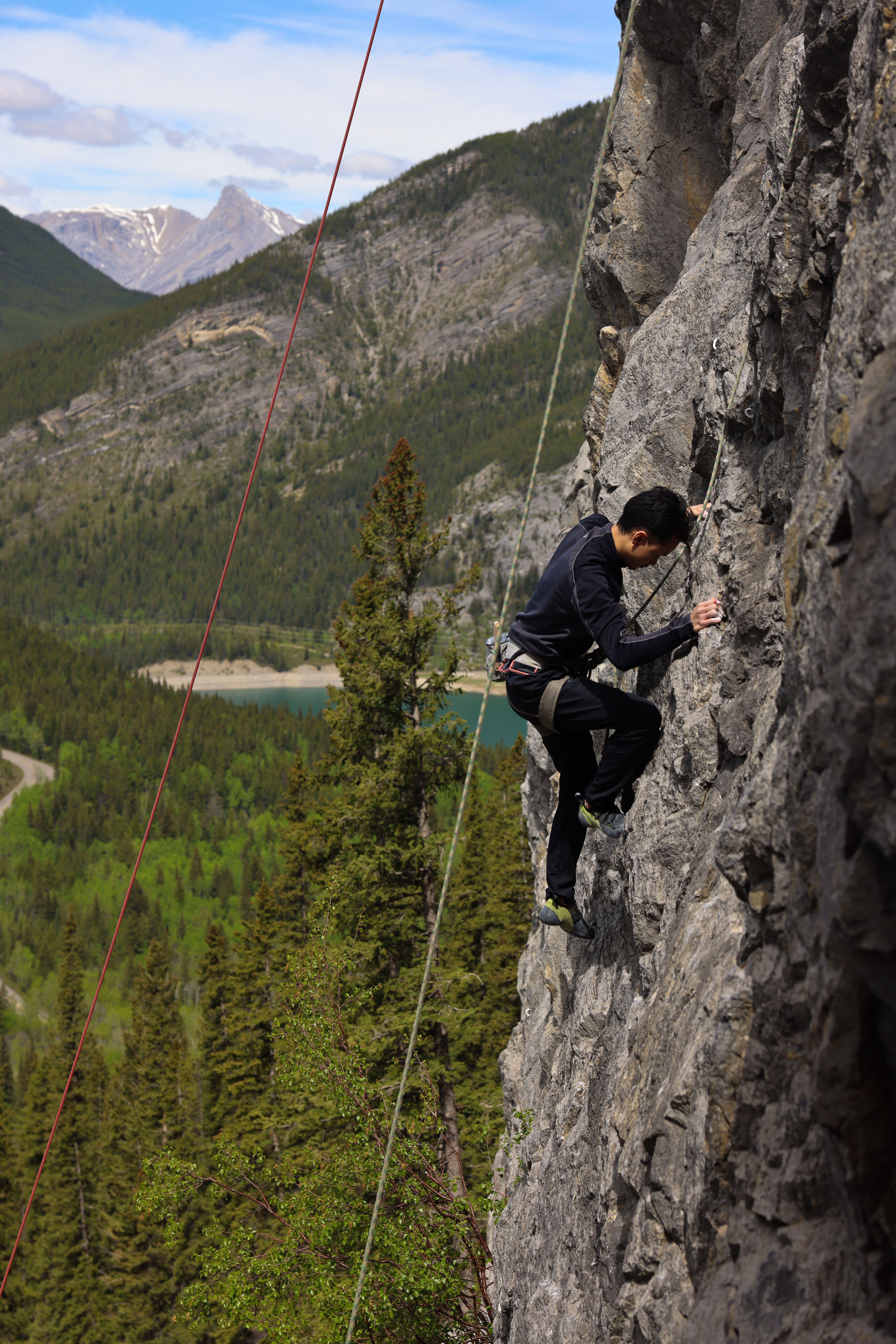 Daring Rock Climber Scaling Mountain Cliff Face · Free Stock Photo