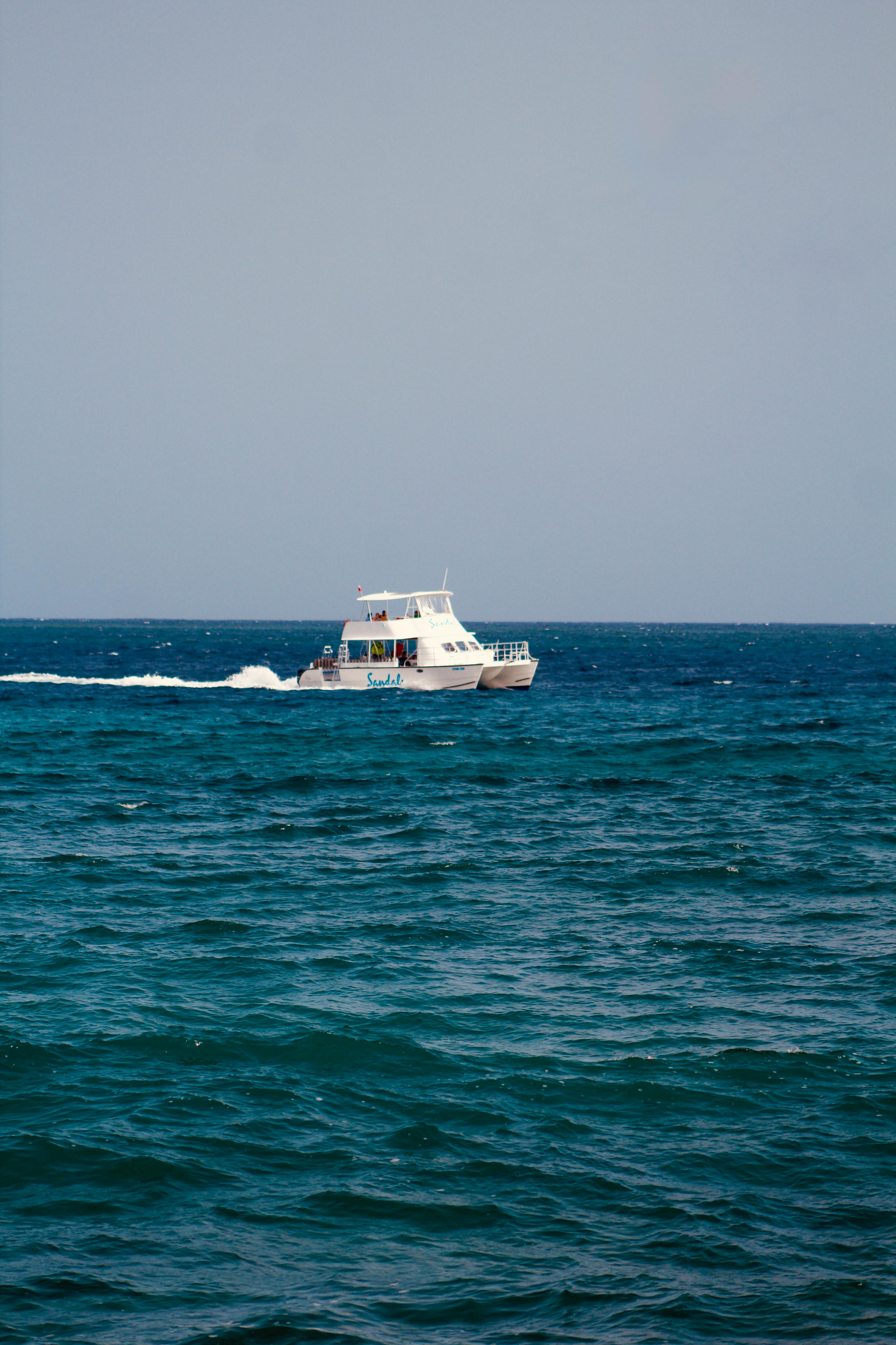 White Speedboat on Deep Blue Ocean Waters · Free Stock Photo