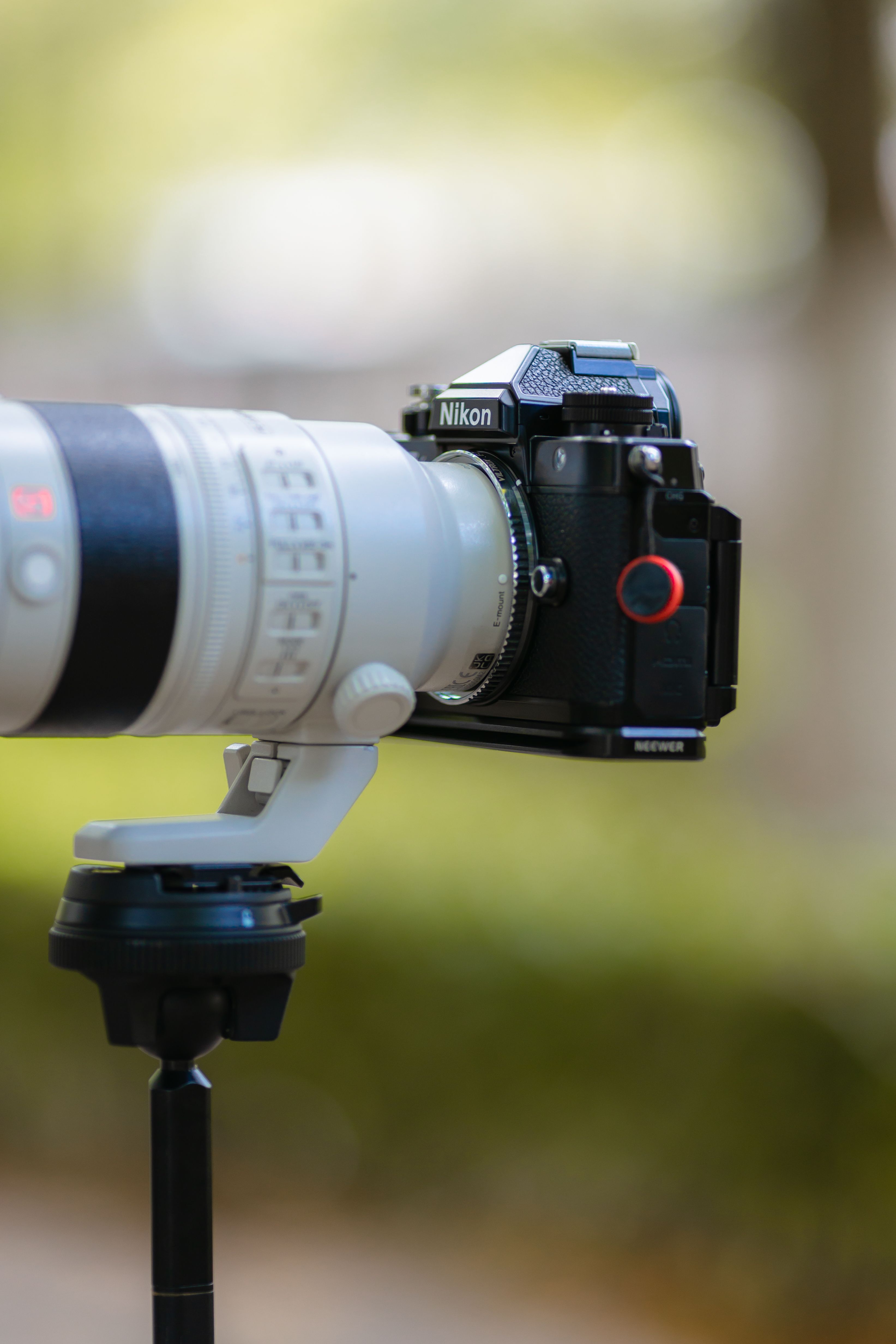 Professional Camera with Telephoto Lens Outdoors · Free Stock Photo