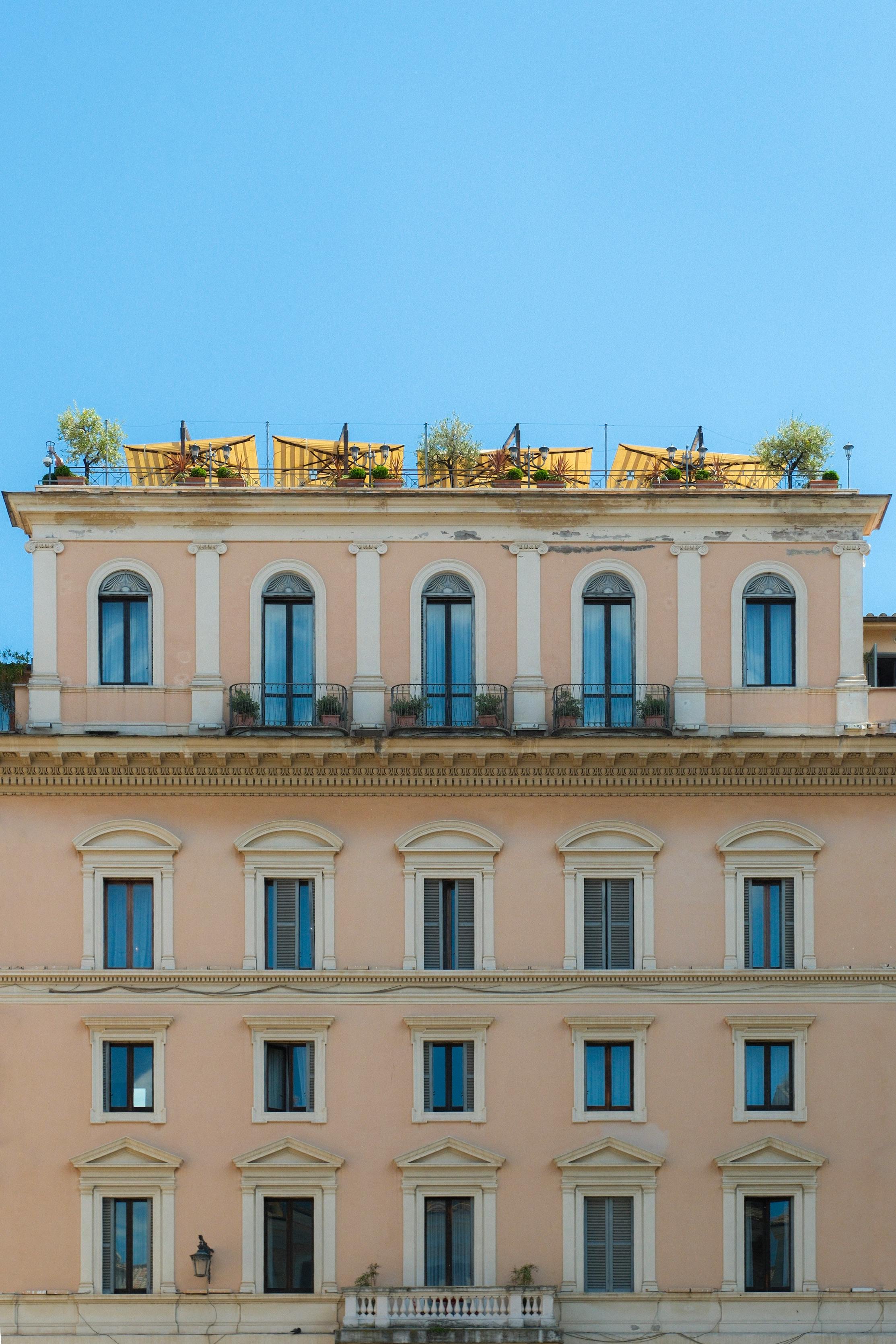 Elegant European Building Facade with Balconies · Free Stock Photo