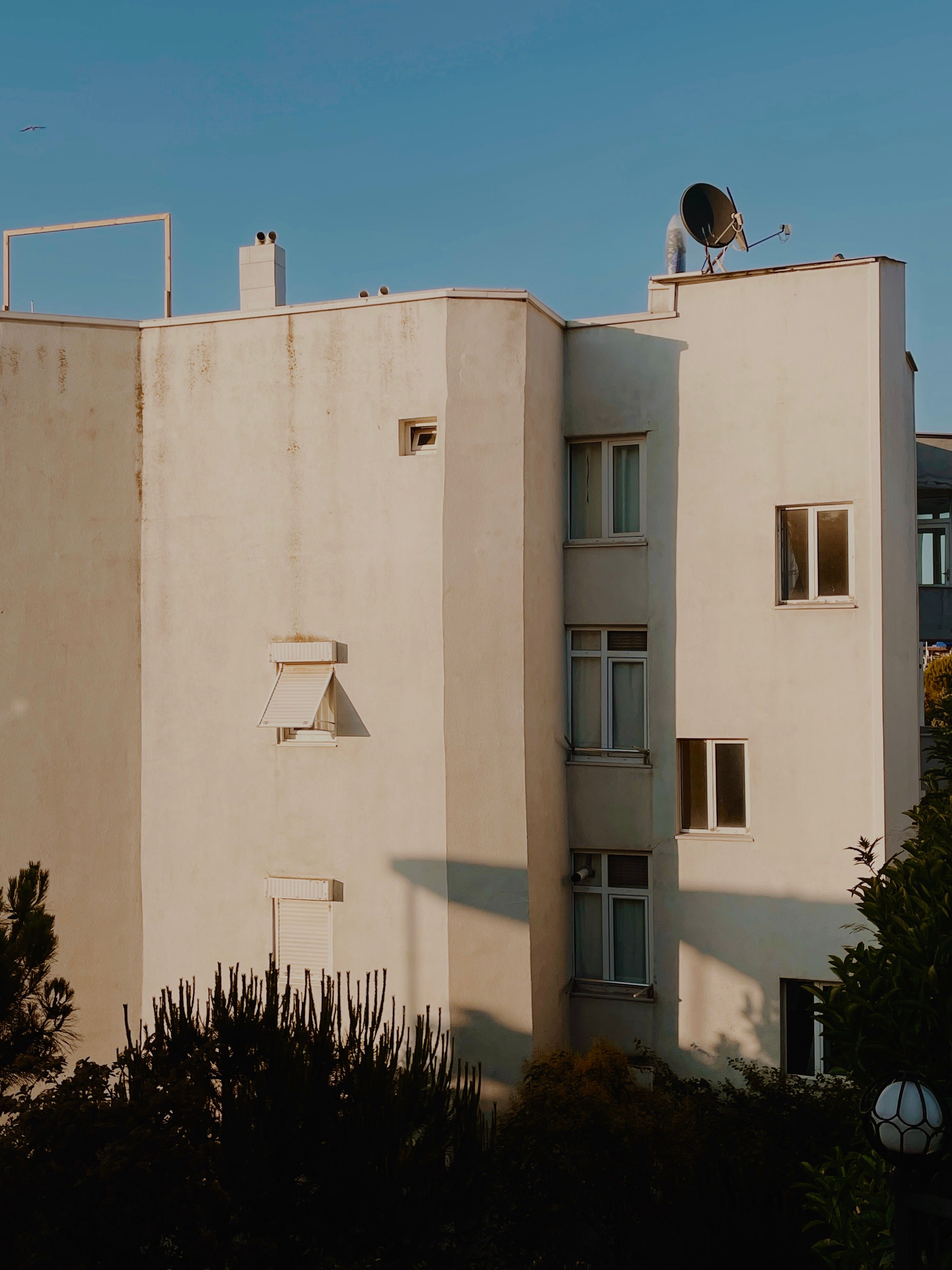 Urban Building Exterior with Satellite Dish · Free Stock Photo
