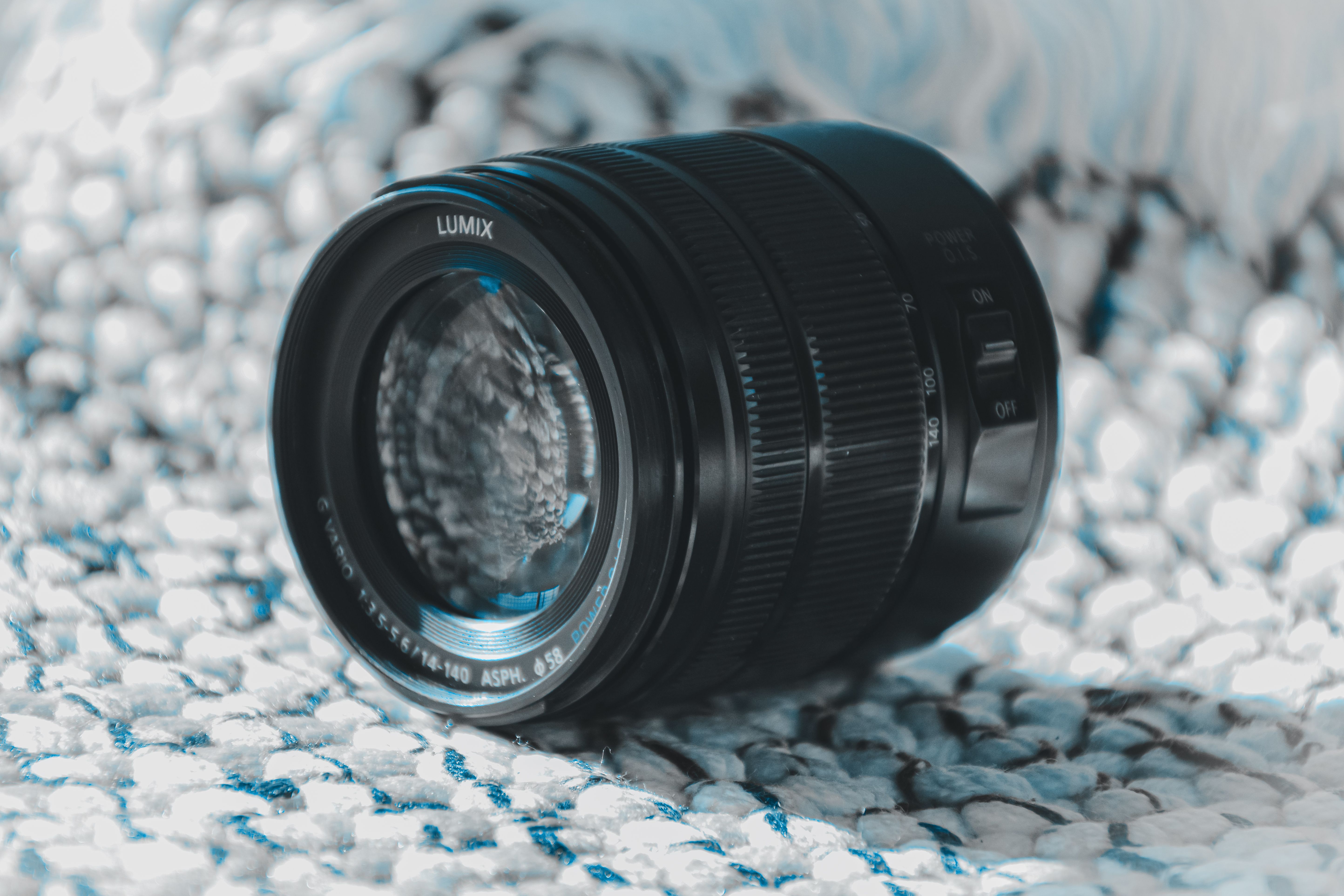 Close-Up of Camera Lens on Textured Surface · Free Stock Photo