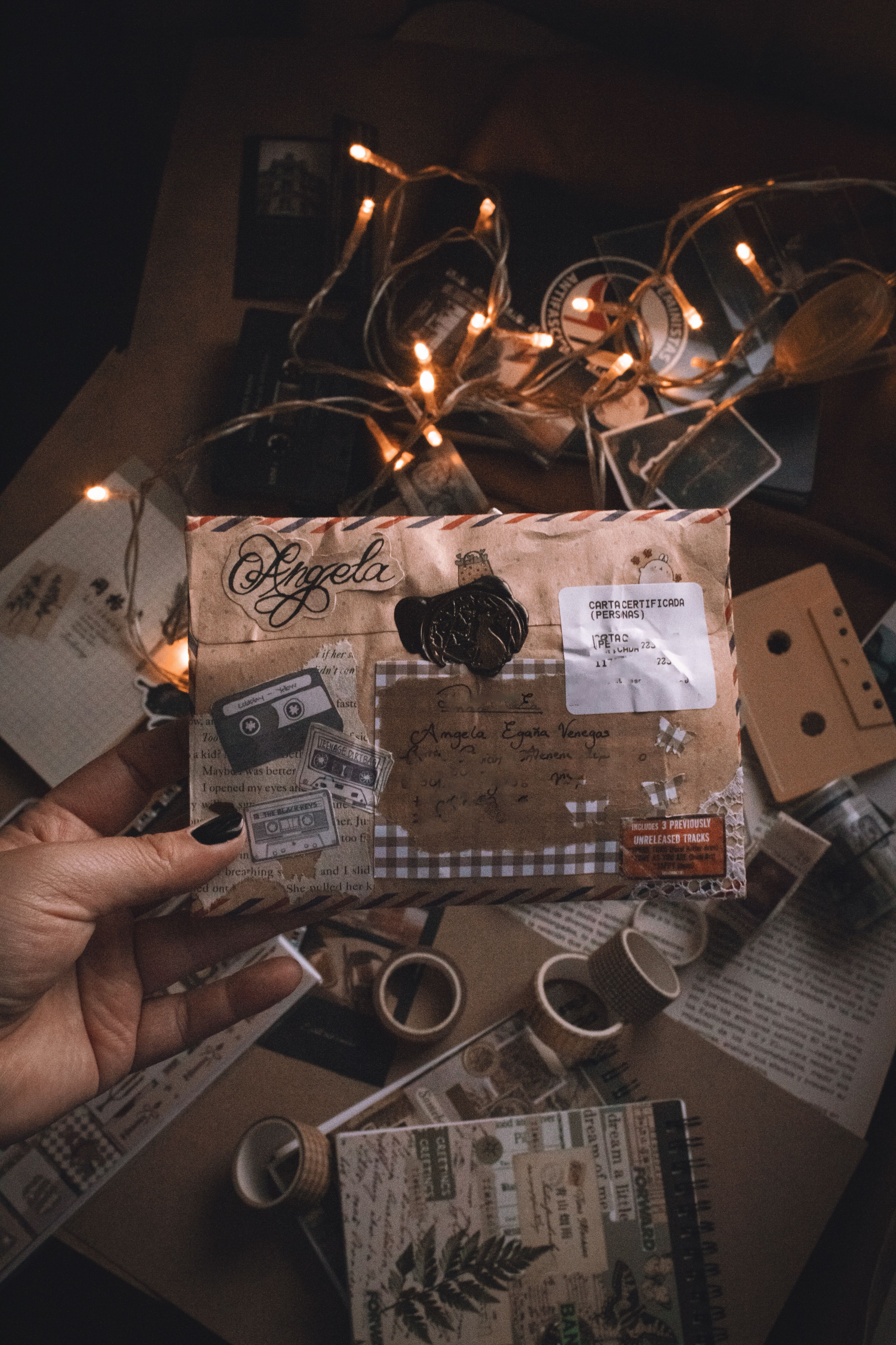 Vintage Letter with Warm Fairy Lights in Cozy Setting · Free Stock Photo