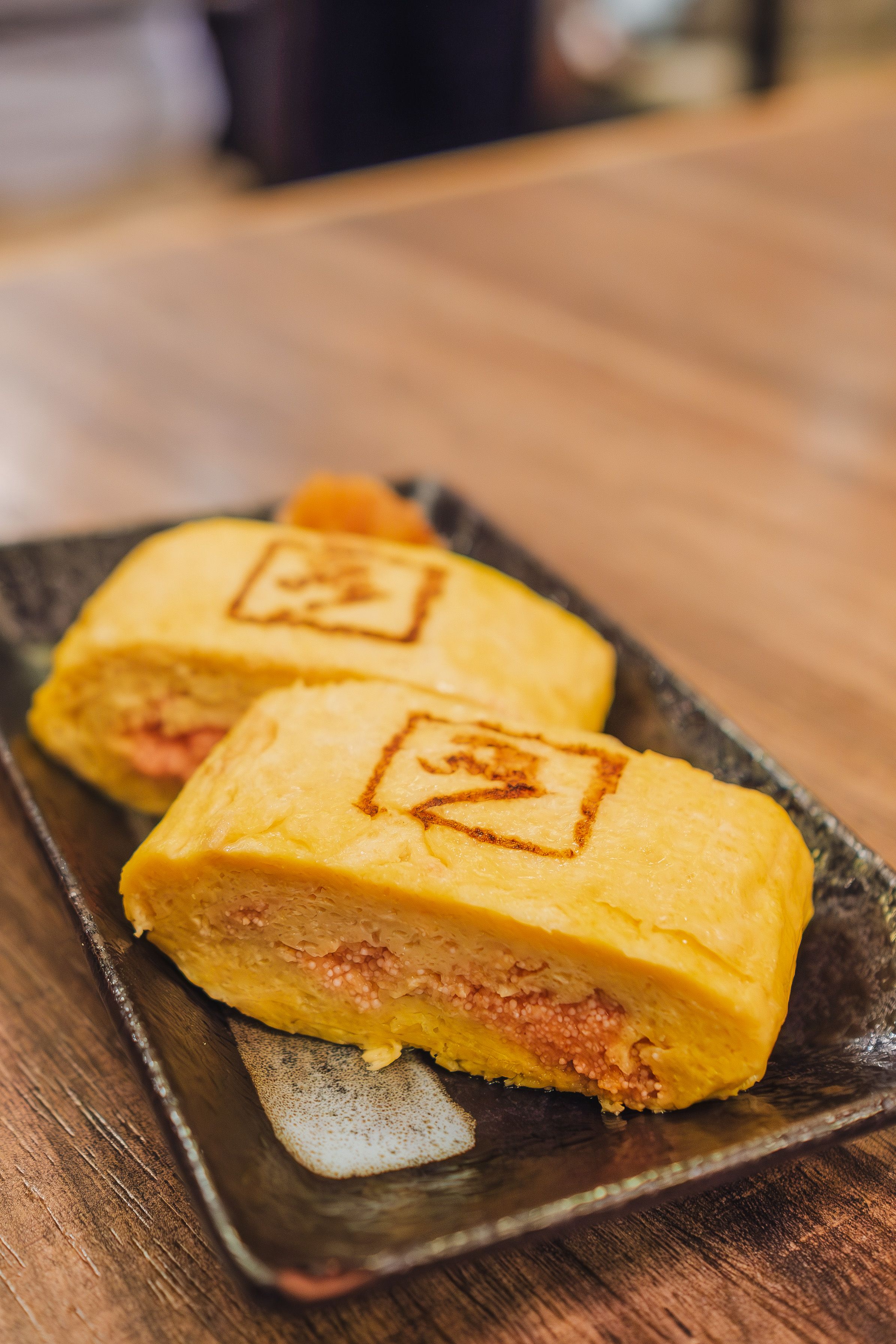 Delicious Japanese Tamagoyaki Omelette Served Indoors · Free Stock Photo