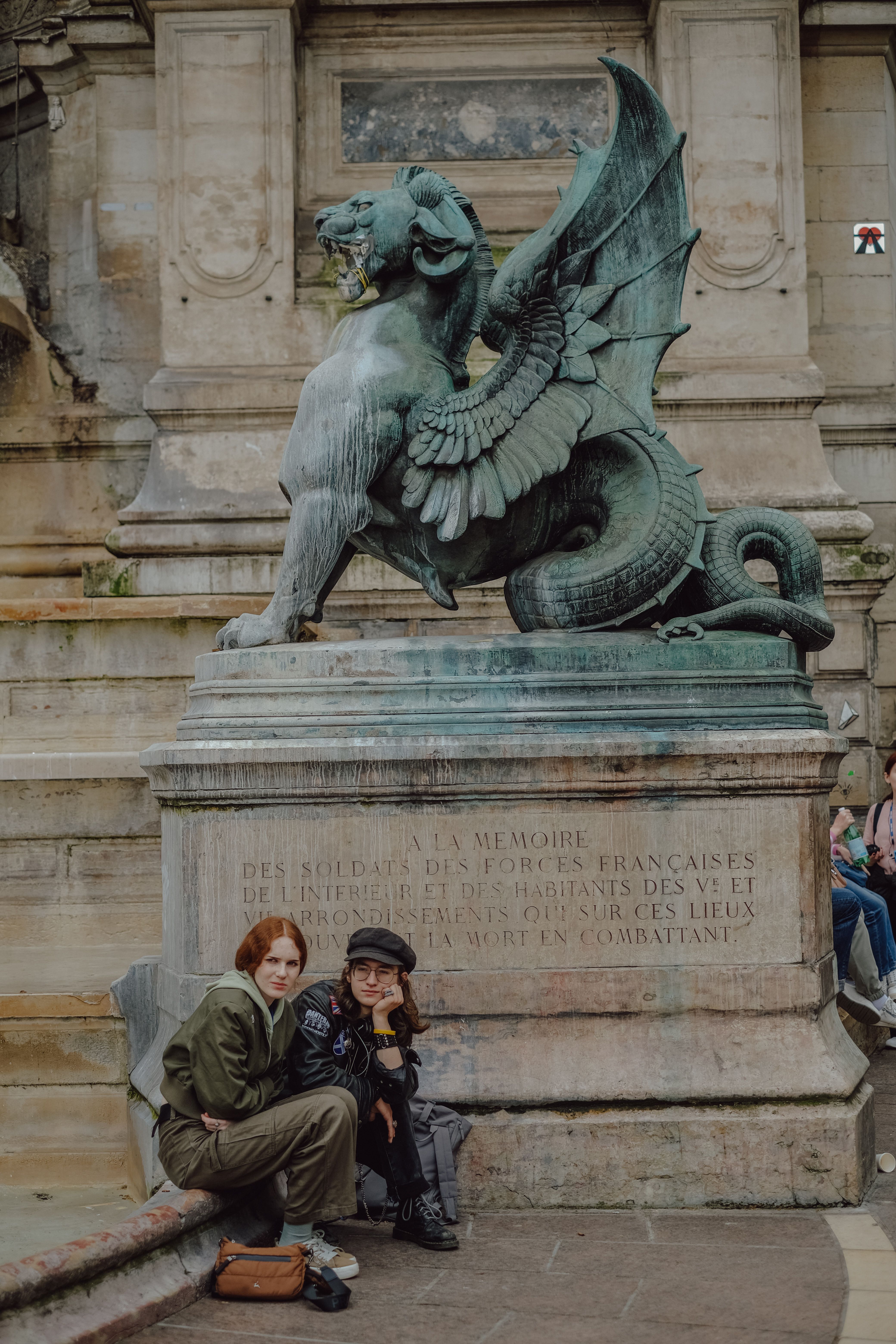 Tourists at Winged Dragon Statue in Paris · Free Stock Photo