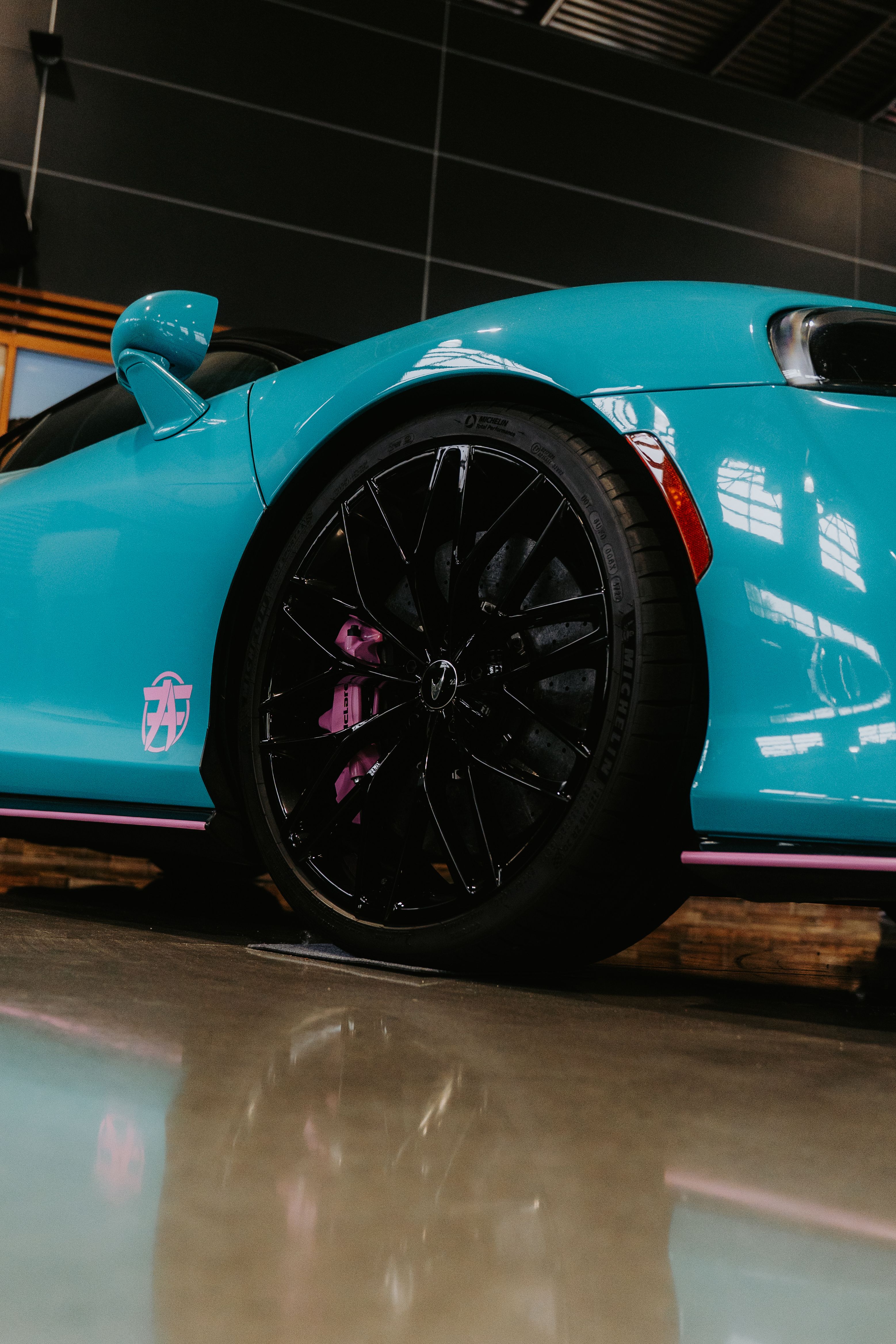 Vibrant Blue Sports Car in Showroom · Free Stock Photo