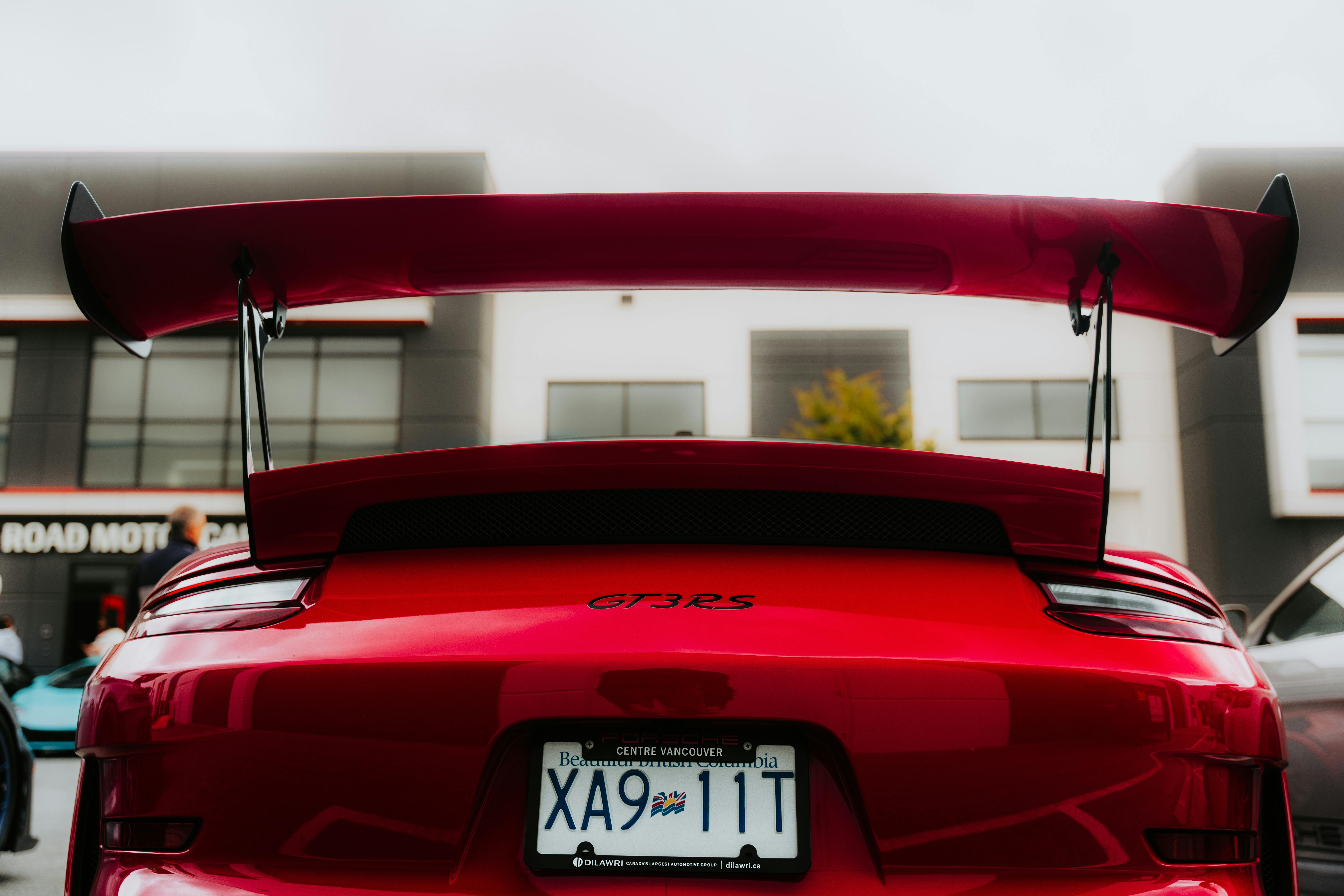 Red Sports Car with Prominent Rear Wing · Free Stock Photo