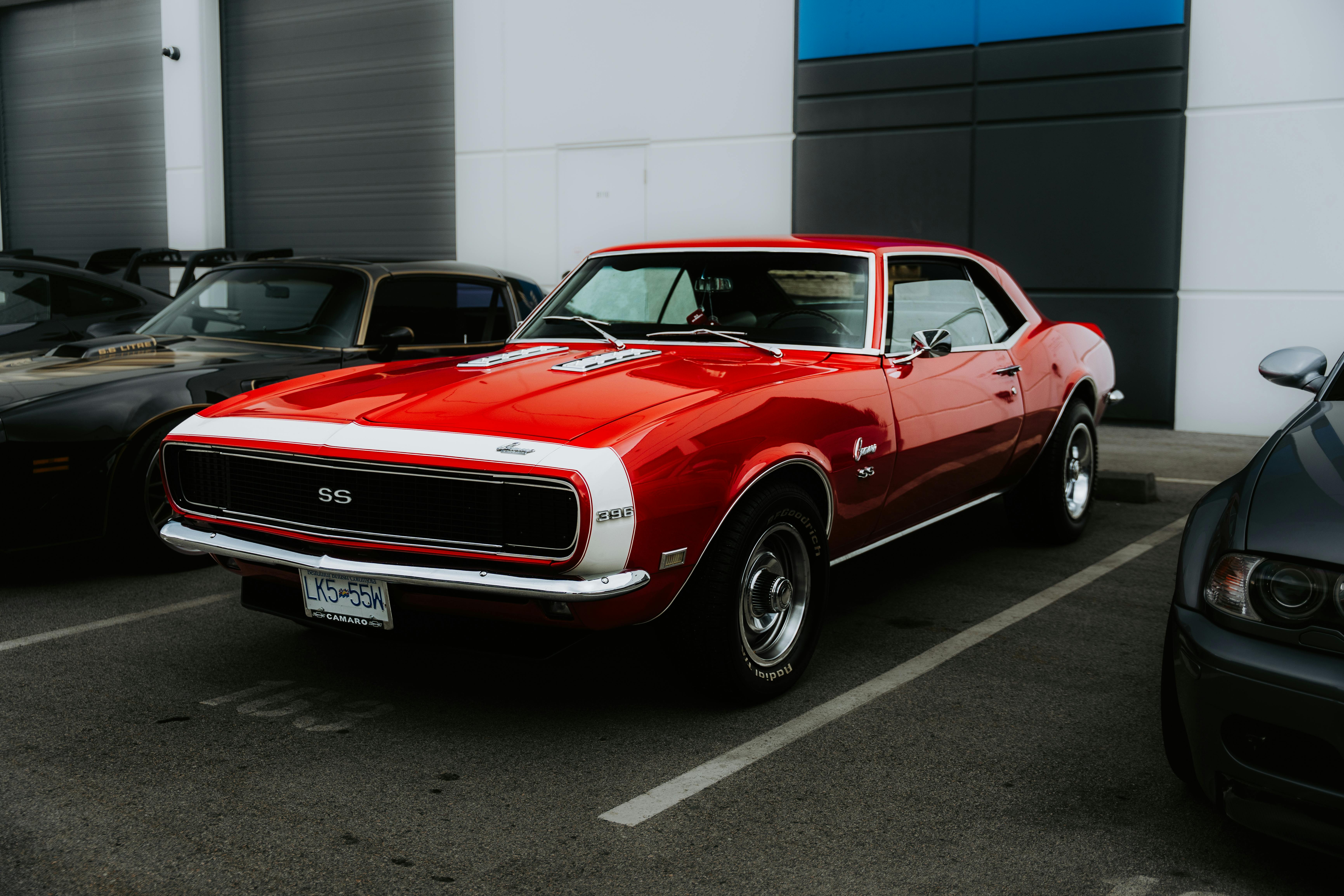Vintage Red Camaro SS in Urban Parking Lot · Free Stock Photo