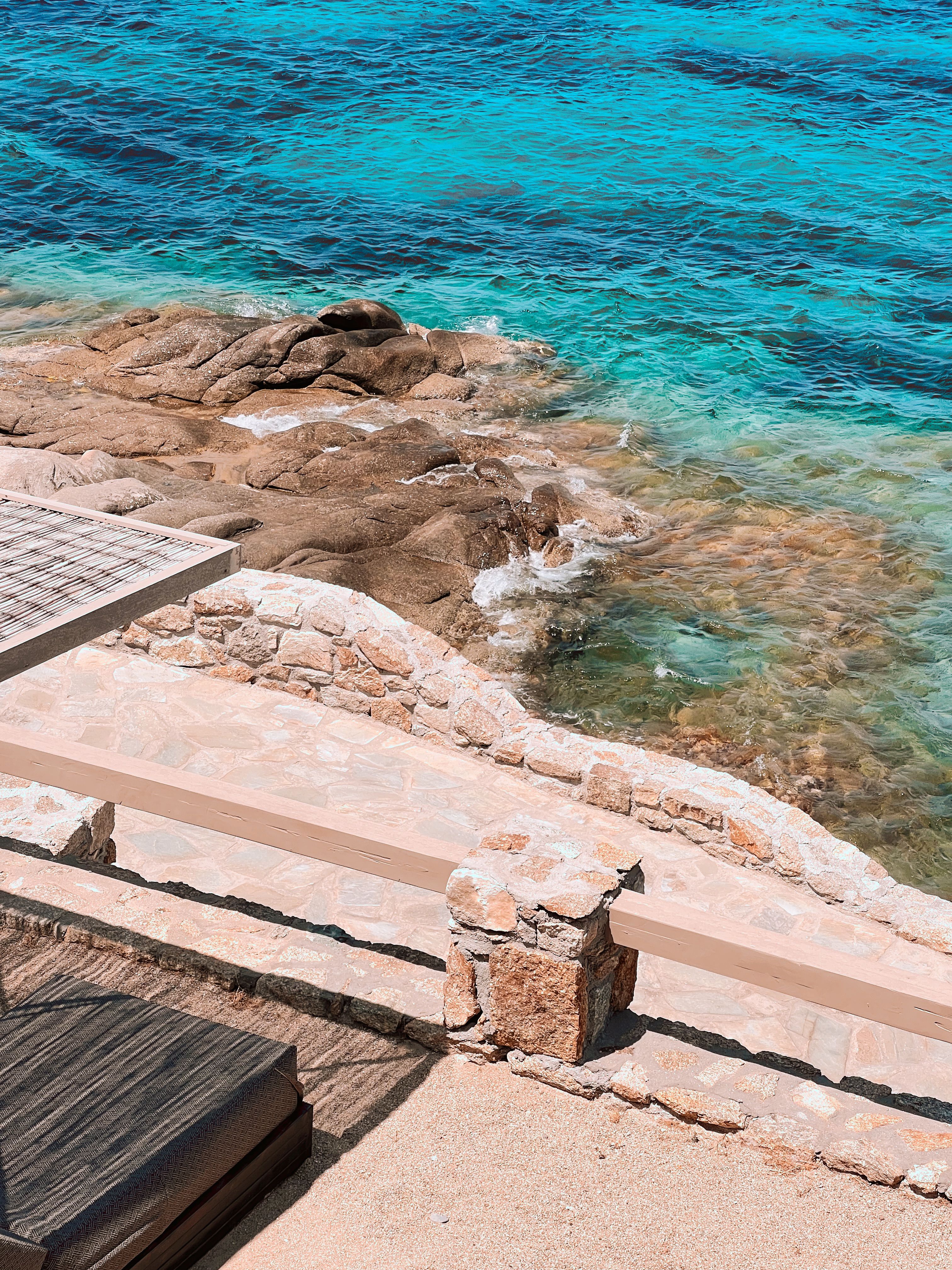 Seaside Patio Overlooking Crystal Blue Ocean Waters · Free Stock Photo