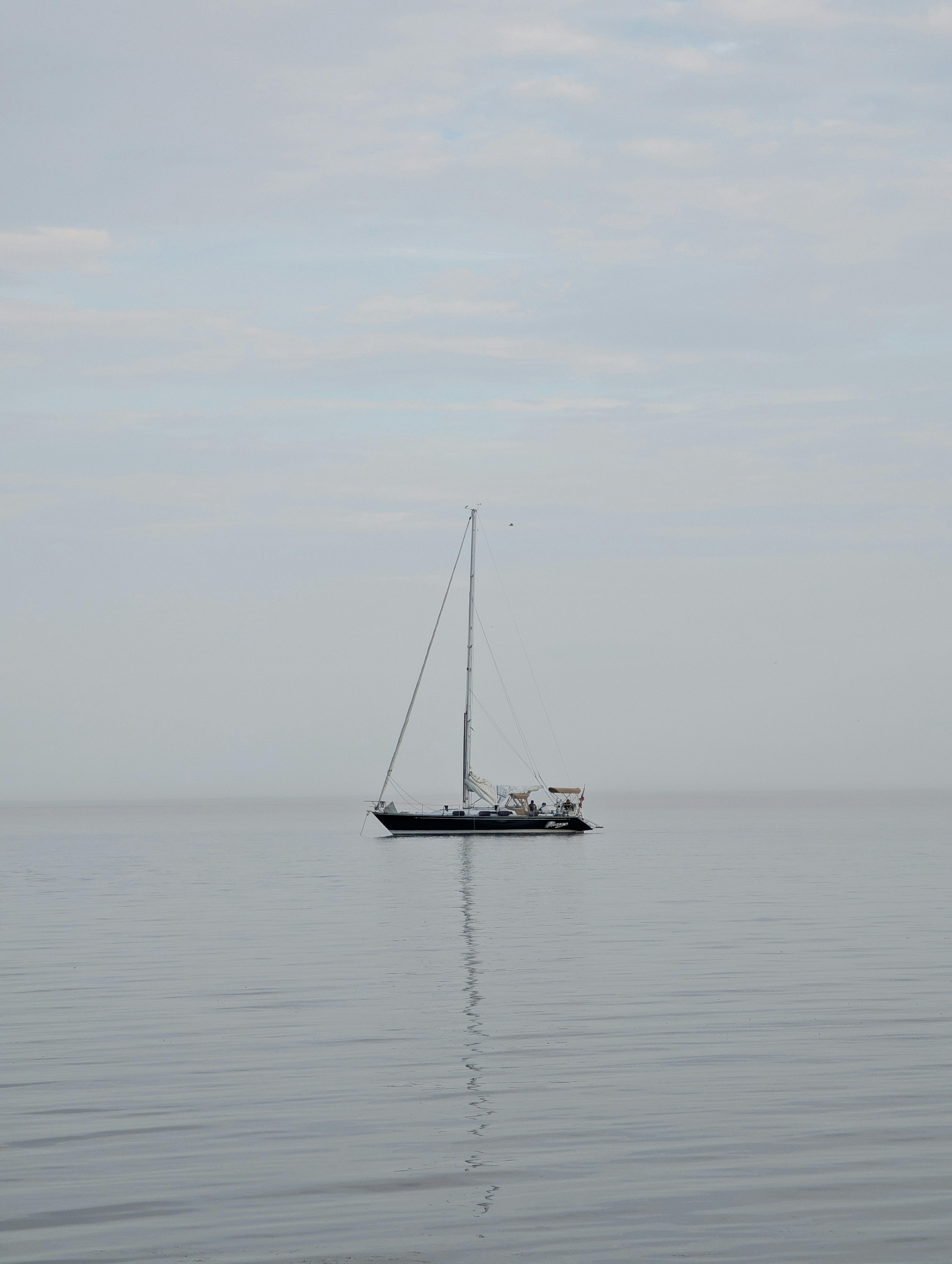 Tranquil Sailboat on Calm Open Sea · Free Stock Photo
