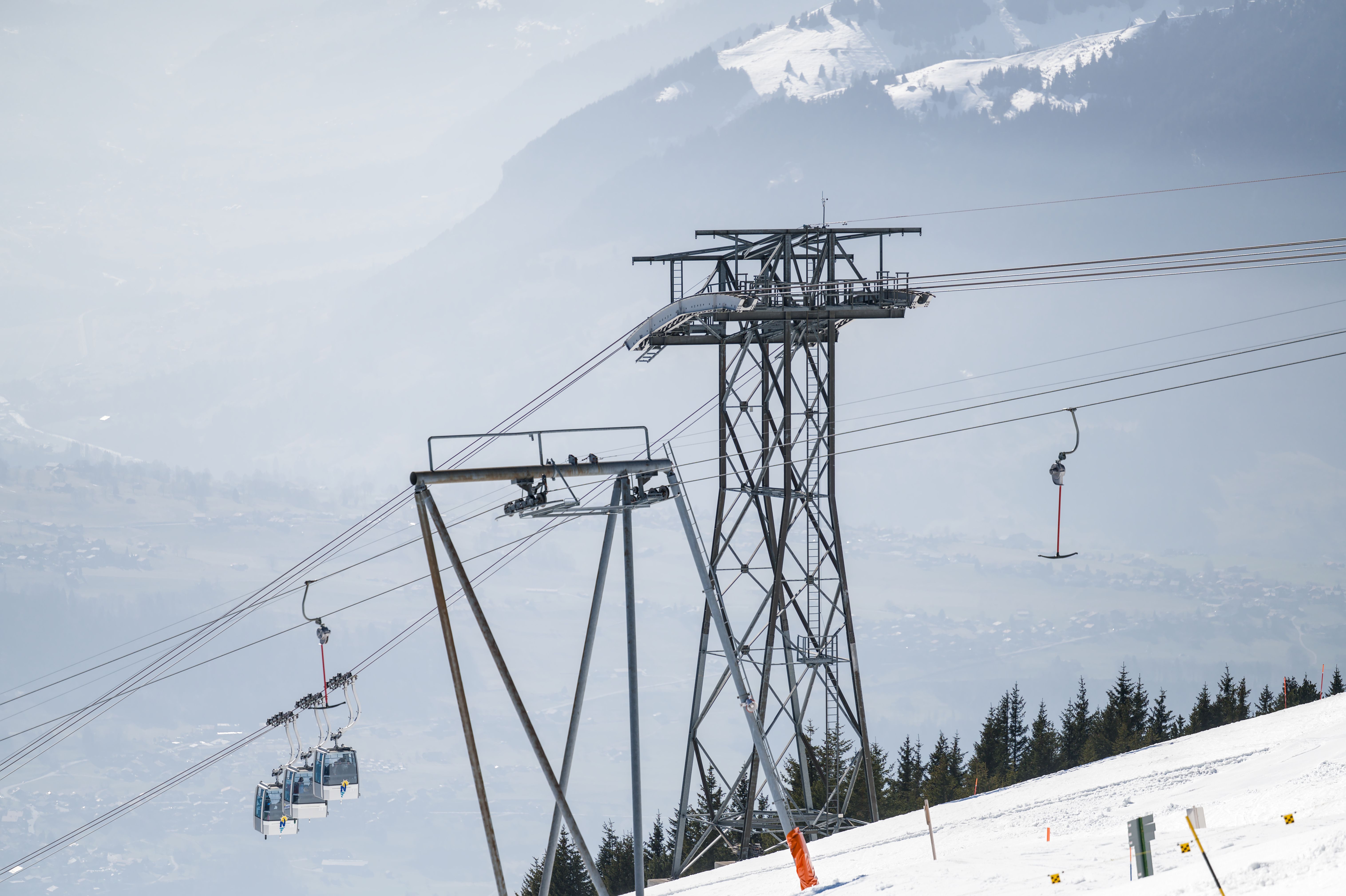Snowy Alpine Cable Car Tower with Mountains · Free Stock Photo