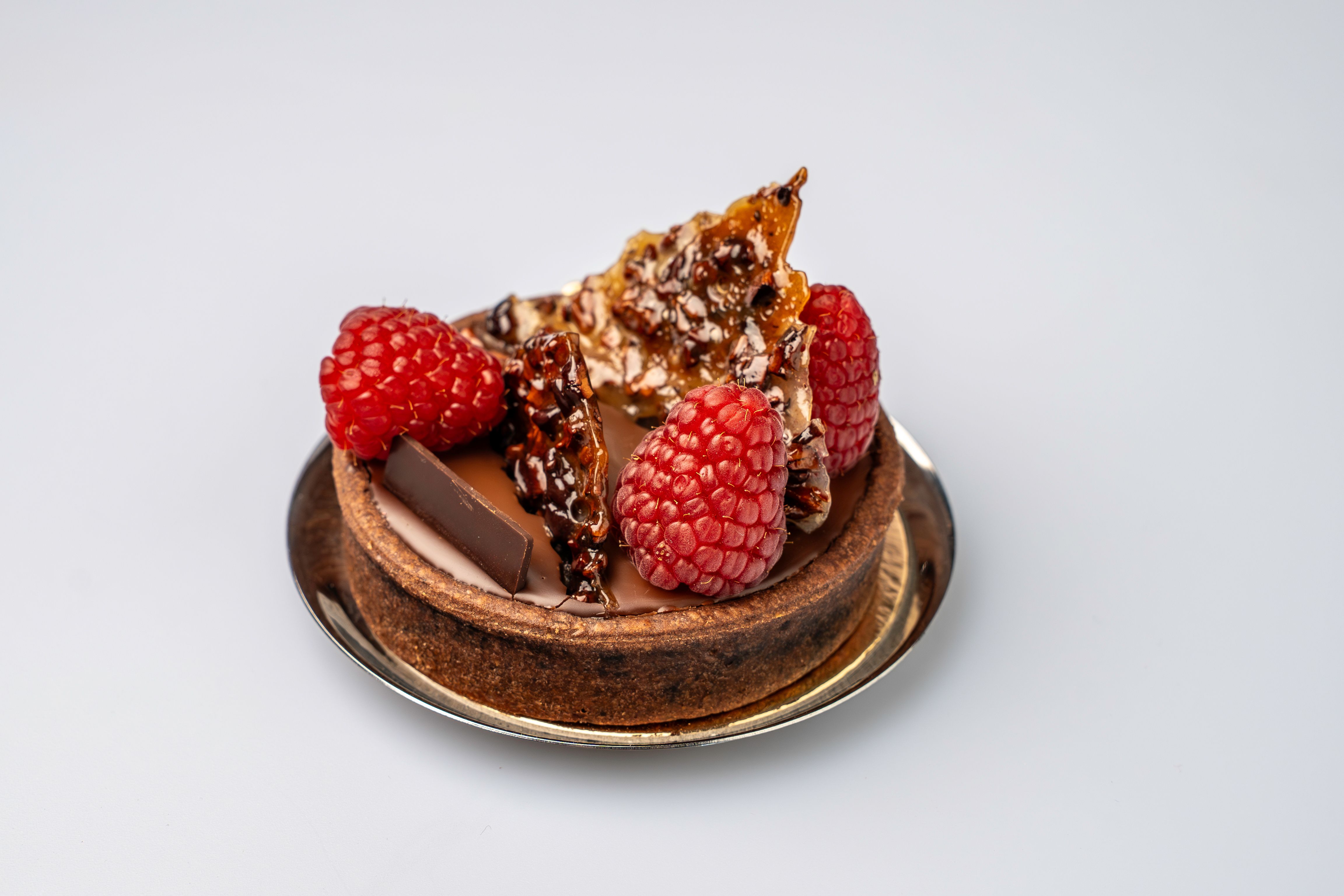 Delicious Raspberry and Chocolate Tartlet on White Background · Free ...