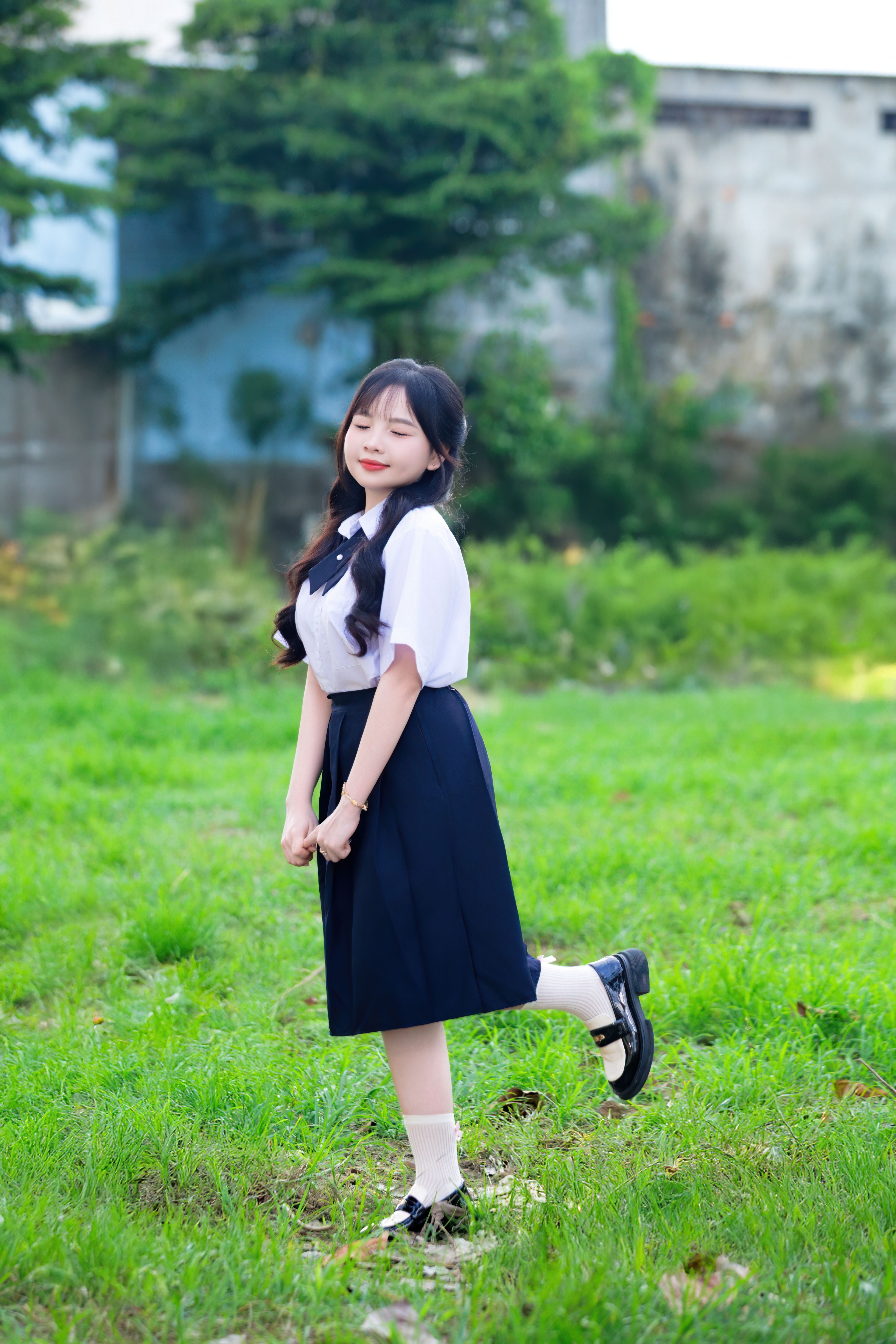 Young Student Enjoying a Sunny Day in School Uniform · Free Stock Photo