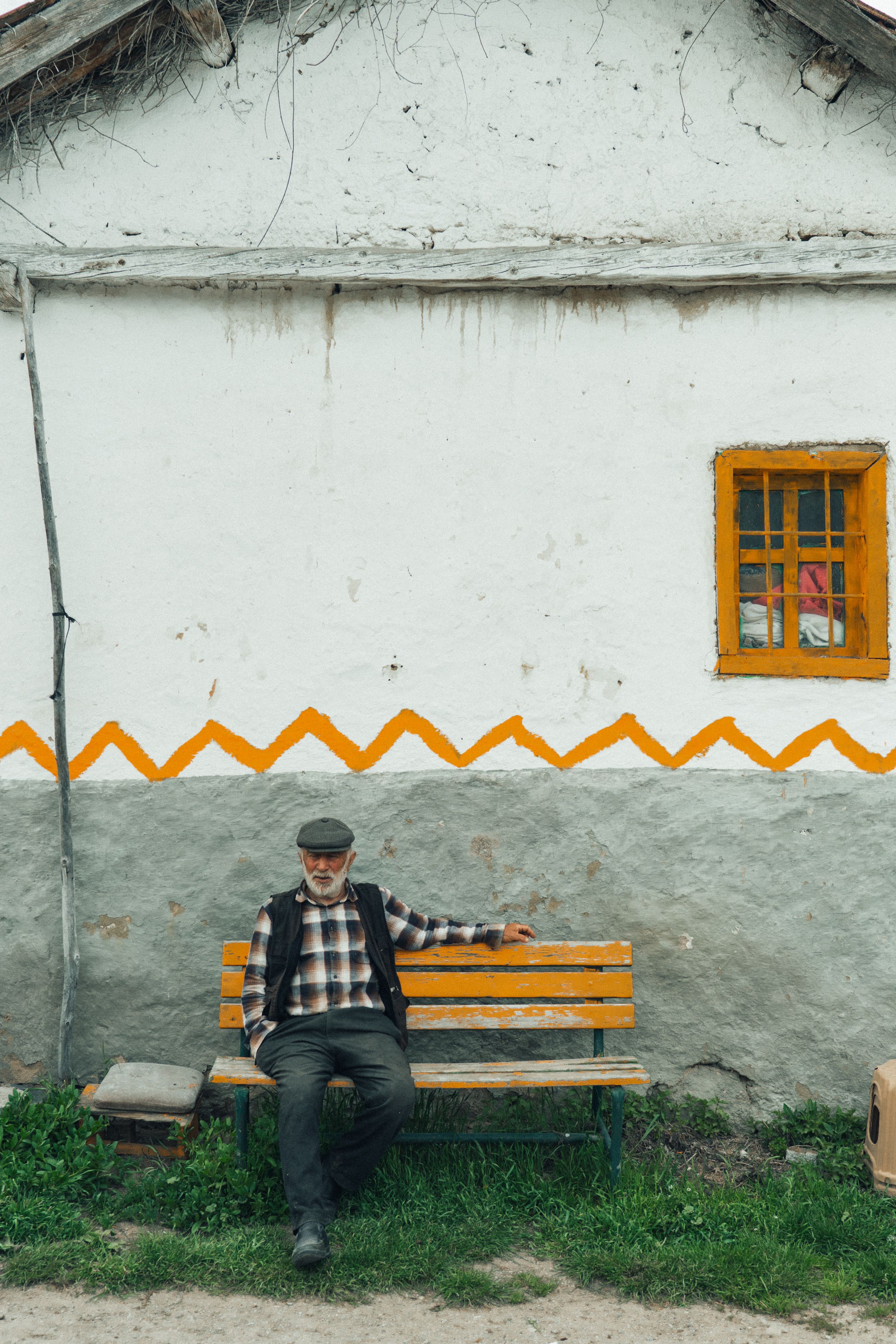 Elderly Man Sitting on Bench in Turkish Village · Free Stock Photo