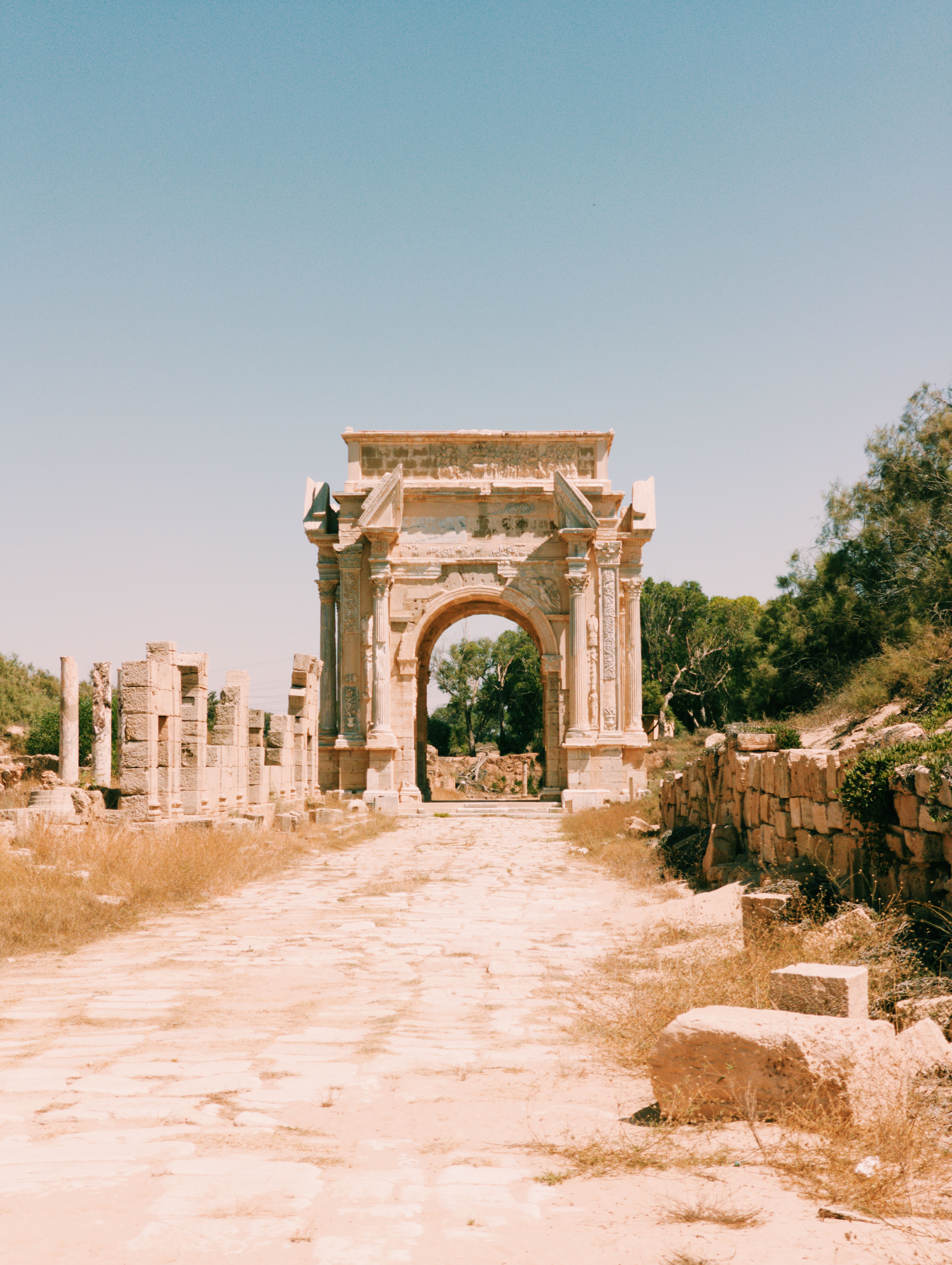 Ancient Arch and Ruins in Sunny Landscape · Free Stock Photo