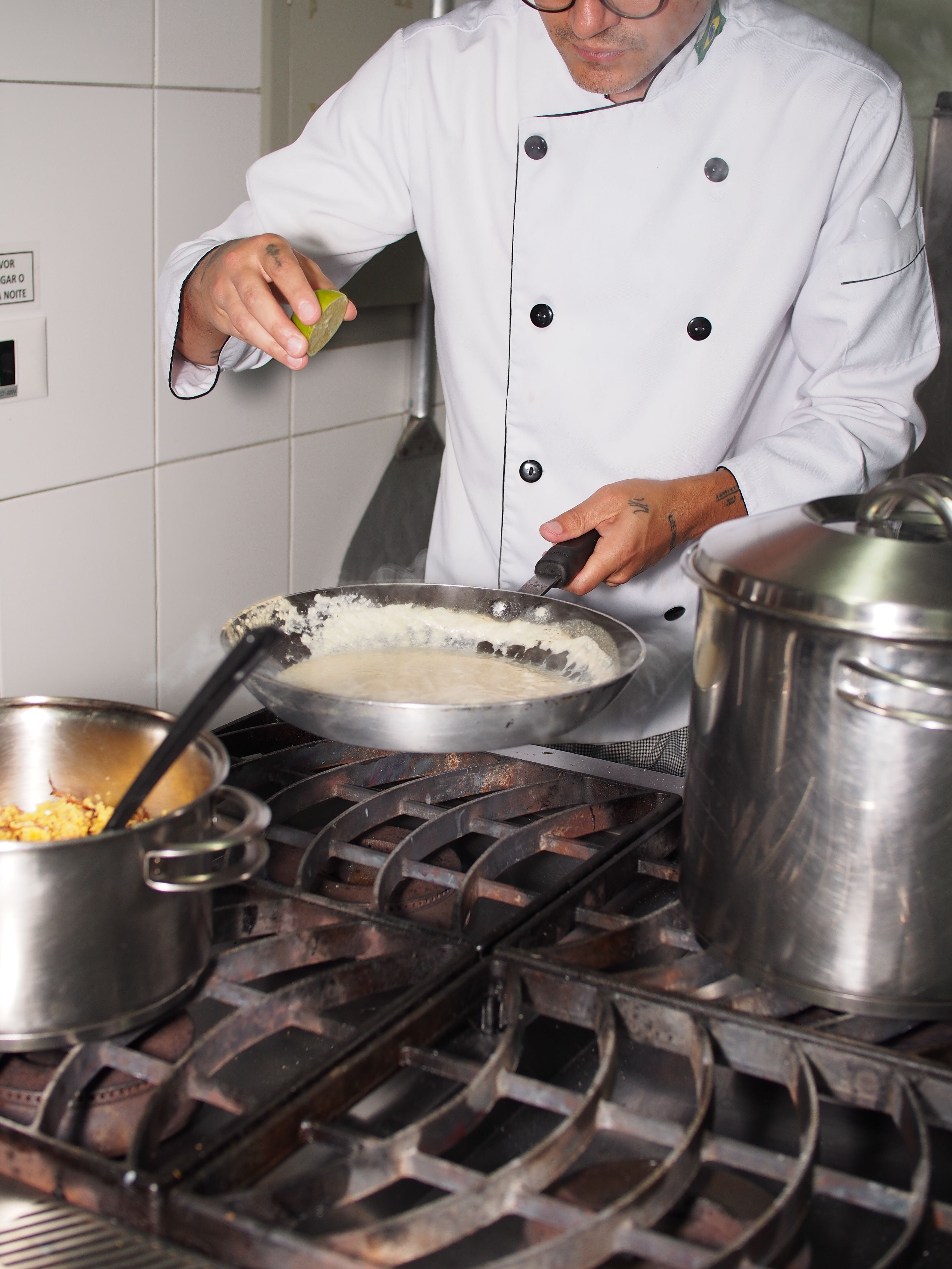 Chef Preparing Creamy Sauce in Professional Kitchen · Free Stock Photo