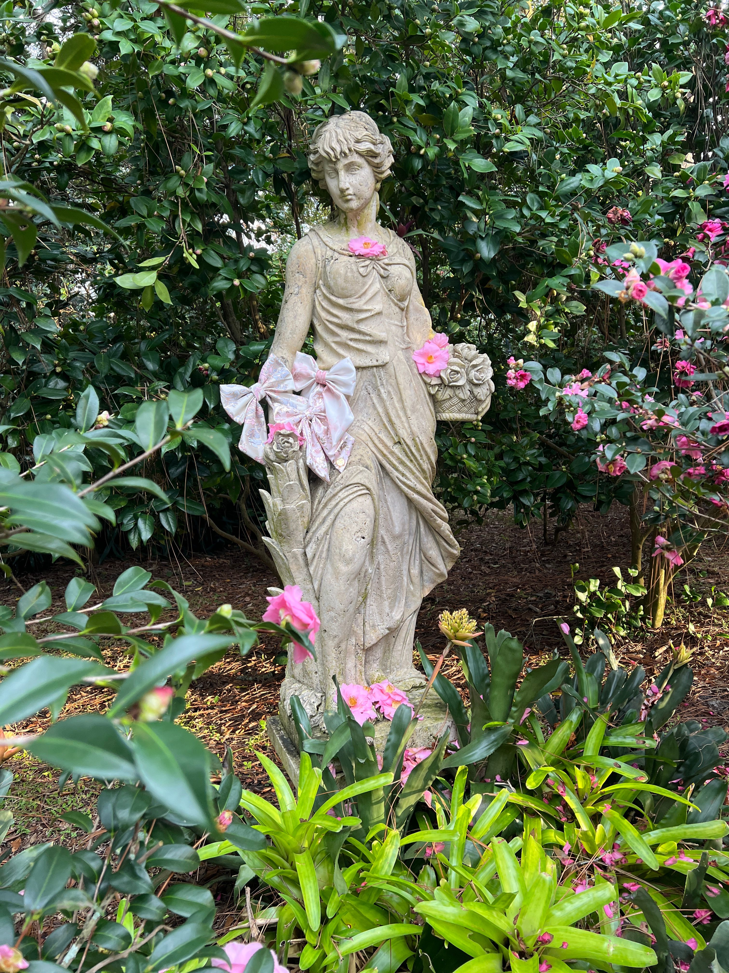 Elegant Garden Statue with Pink Flowers · Free Stock Photo