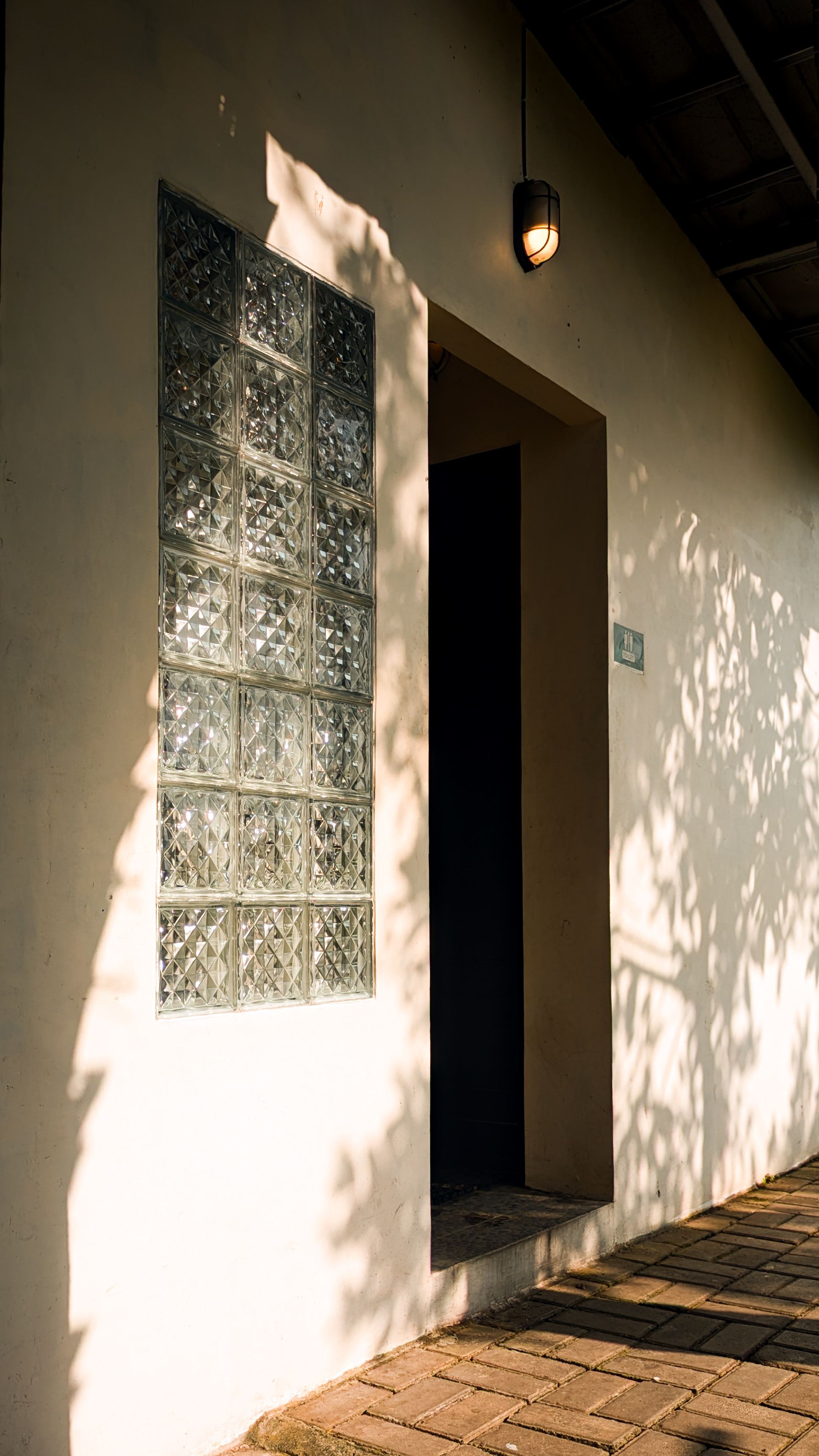 Sunlit Wall with Glass Blocks and Shadows · Free Stock Photo