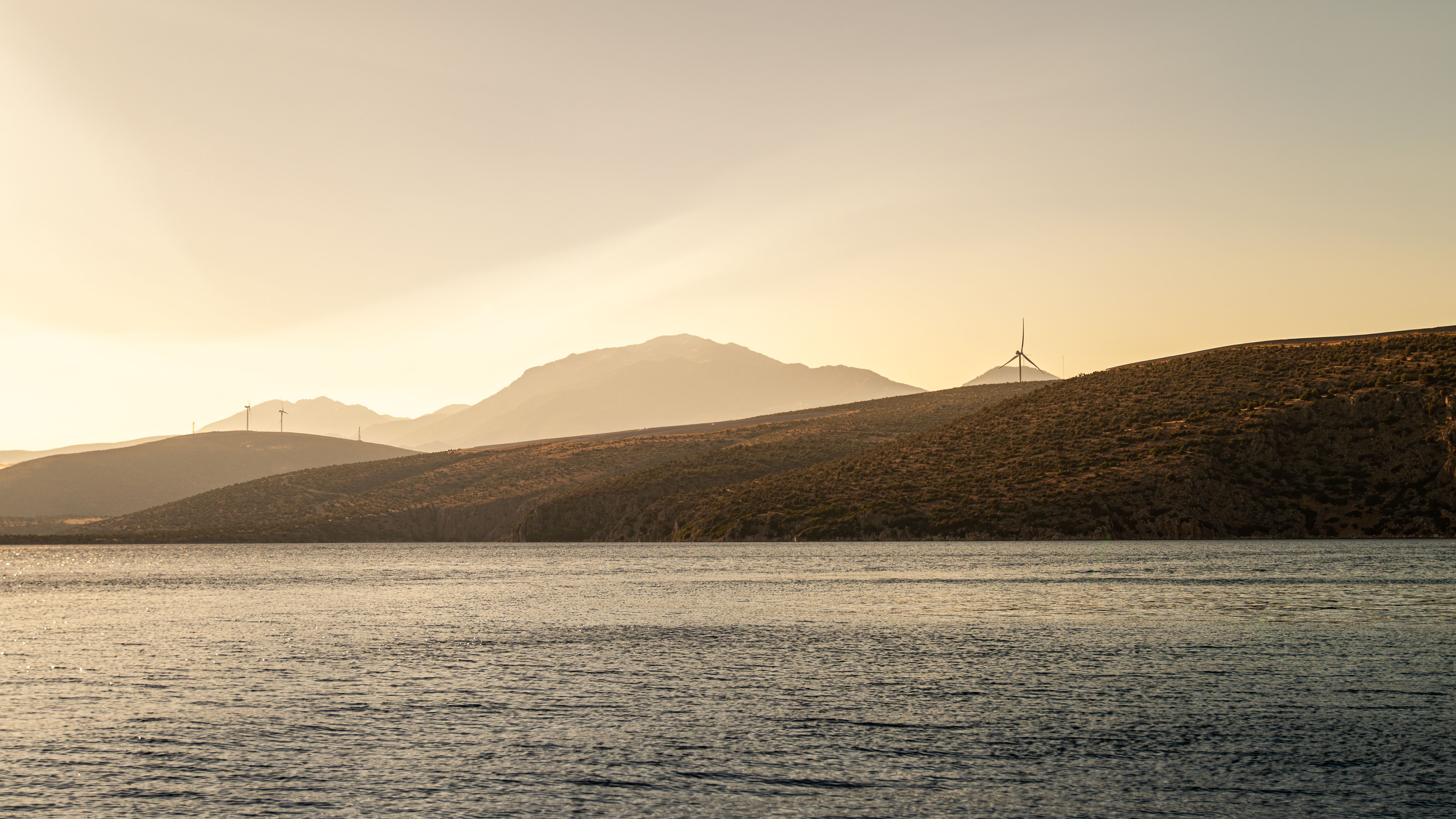 Scenic Sunset Over Greek Wind Turbines · Free Stock Photo
