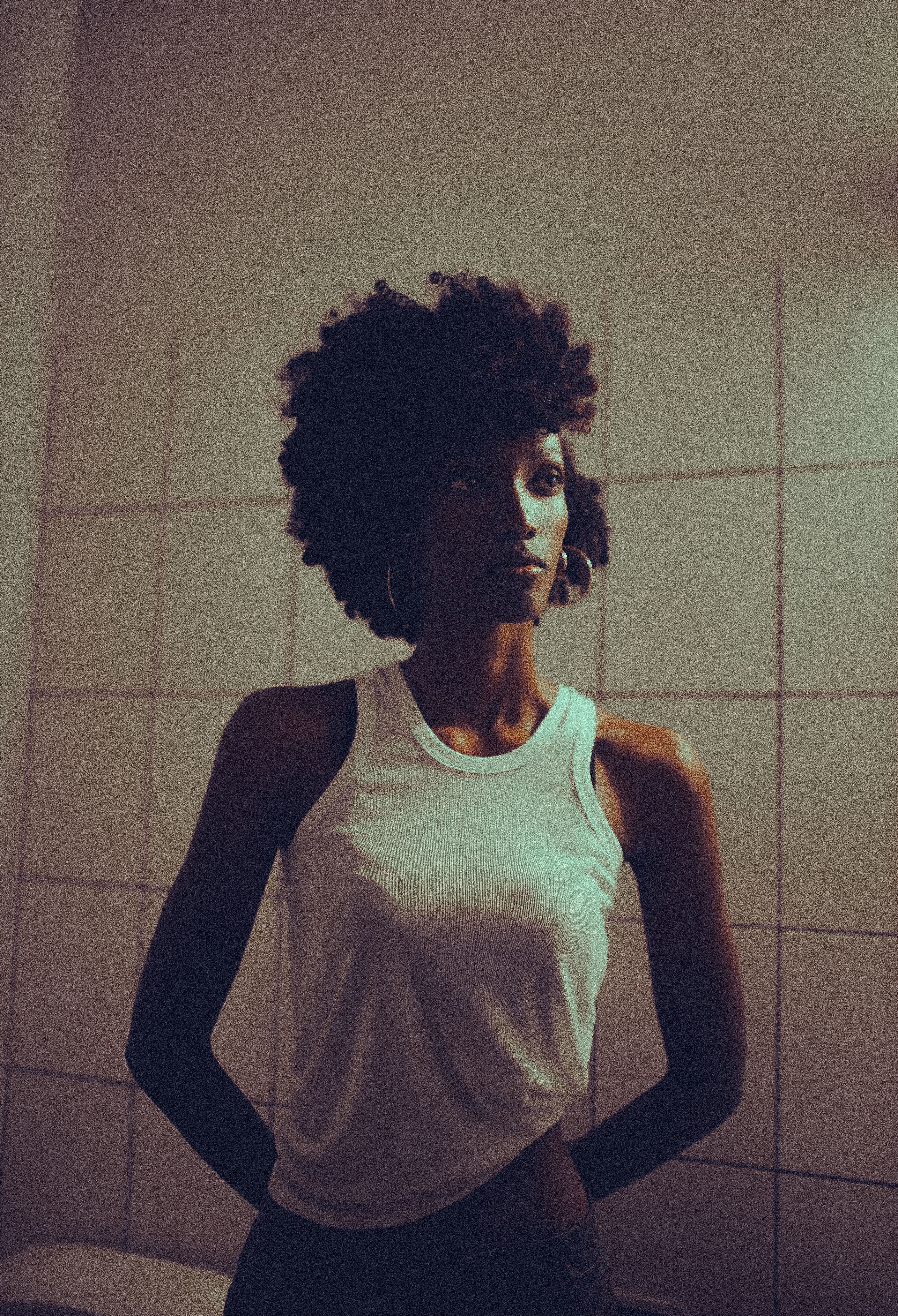 Striking Portrait of Woman in White Top · Free Stock Photo