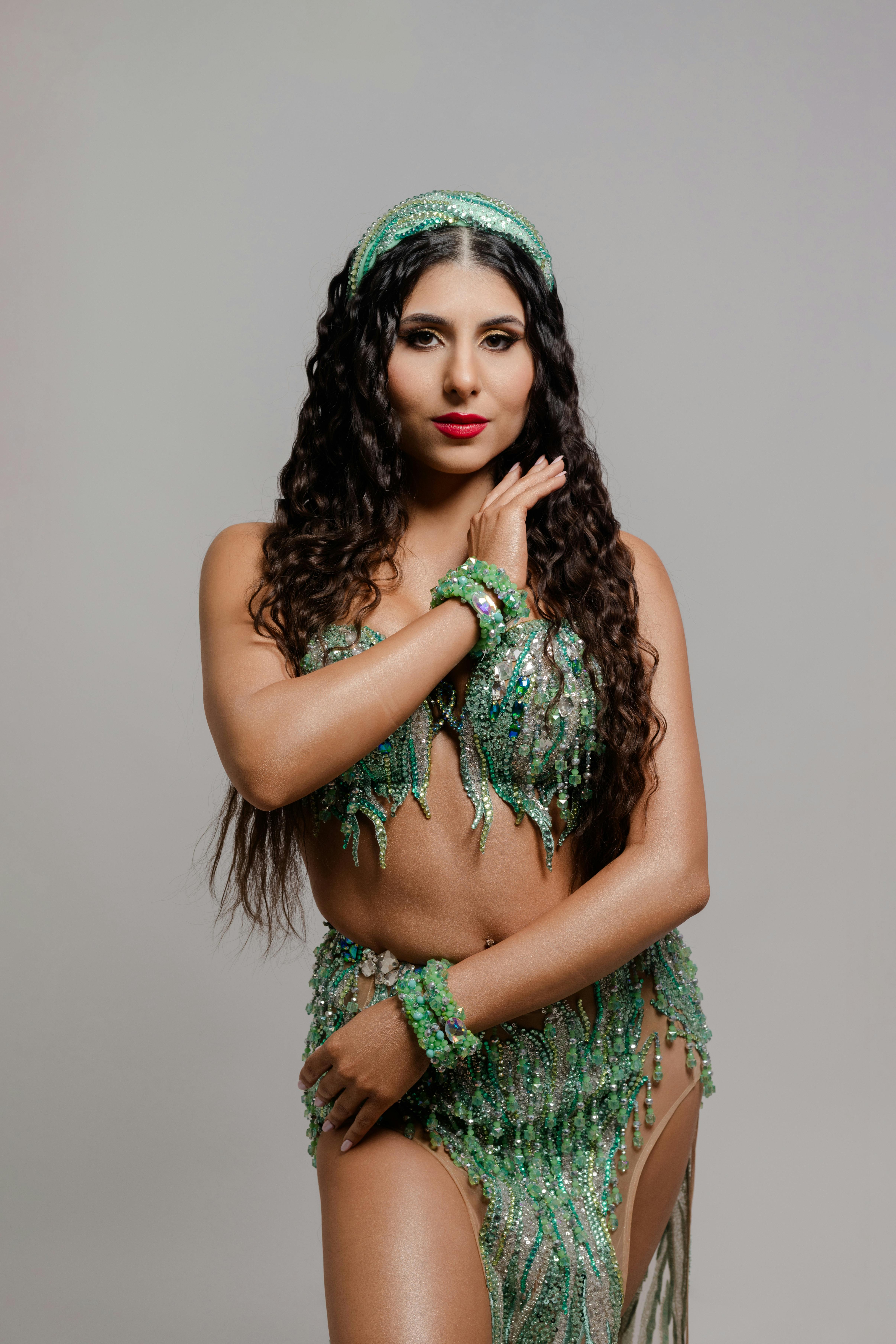 Vibrant Belly Dancer in Emerald Costume · Free Stock Photo