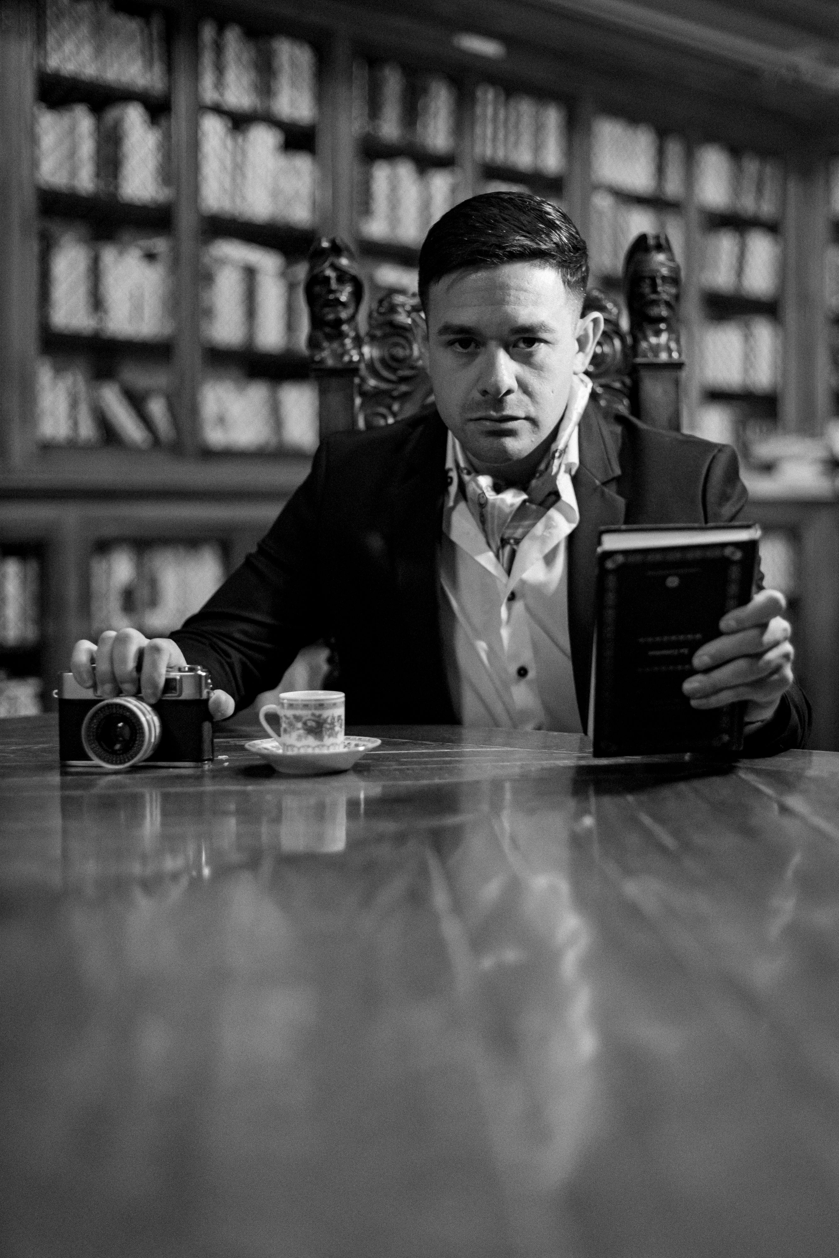 Elegant Portrait of a Man in a Library · Free Stock Photo