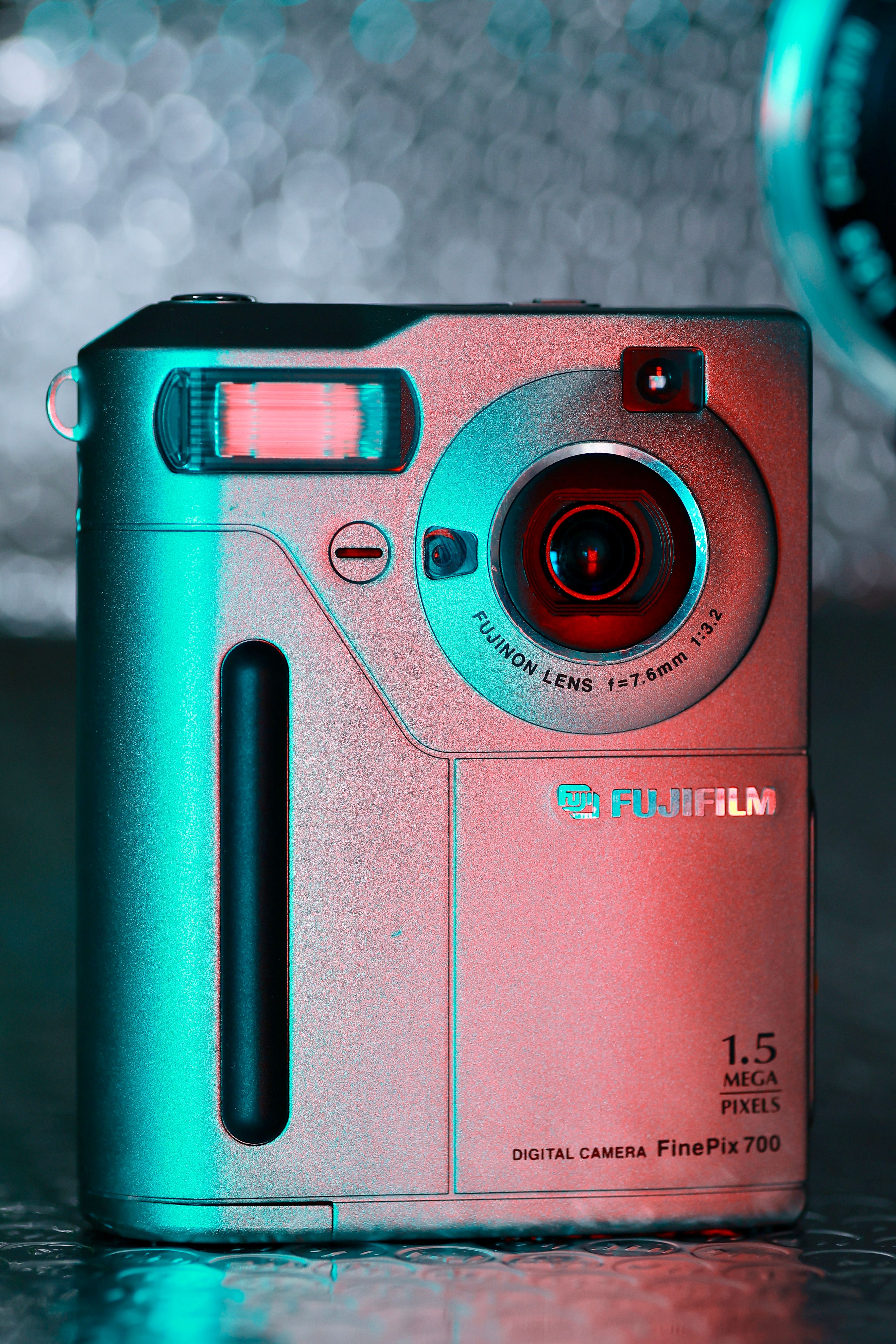 Retro Fujifilm FinePix 700 camera with neon lighting · Free Stock Photo