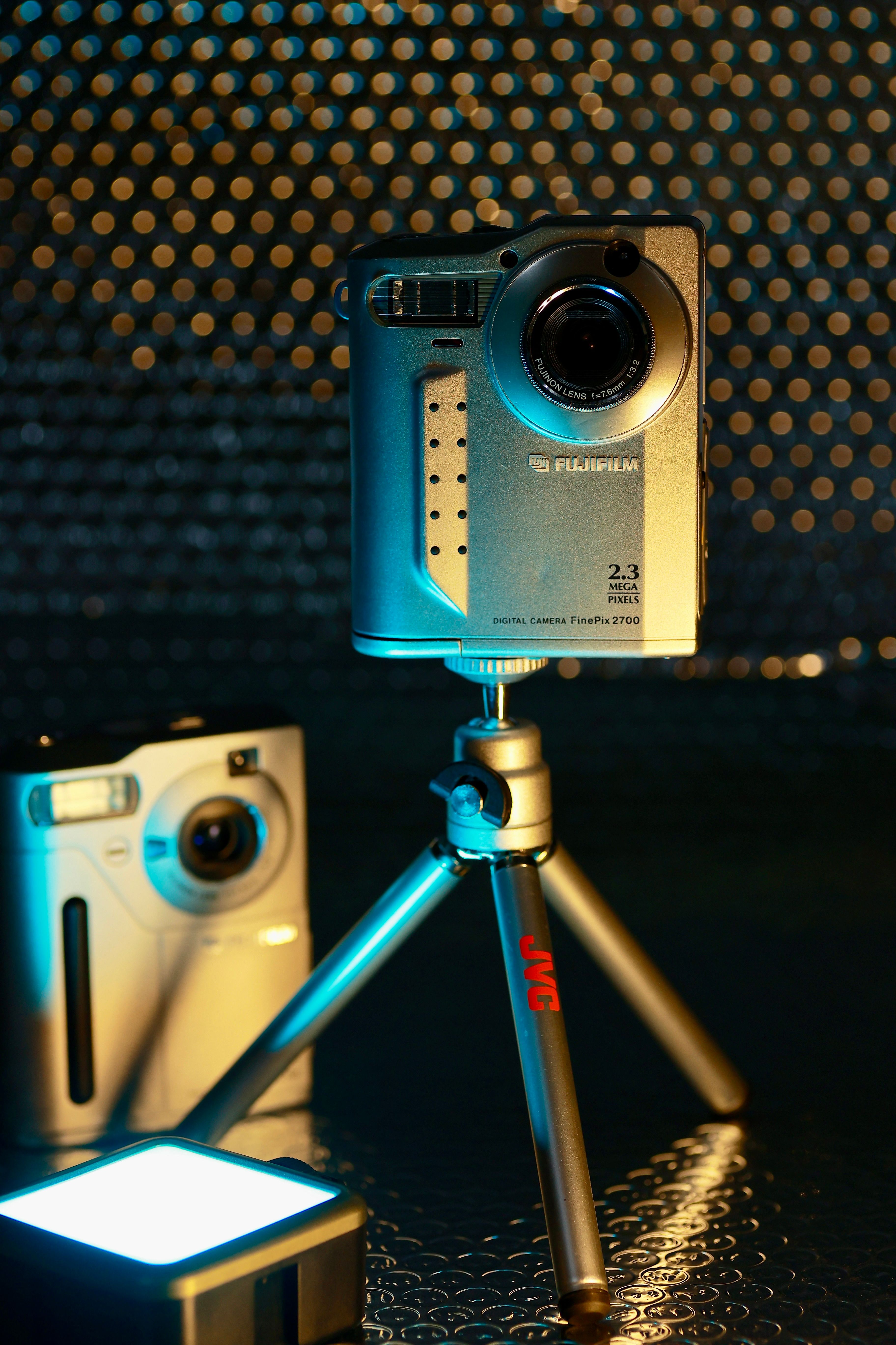 Retro Cameras with Tripod in Artistic Lighting · Free Stock Photo