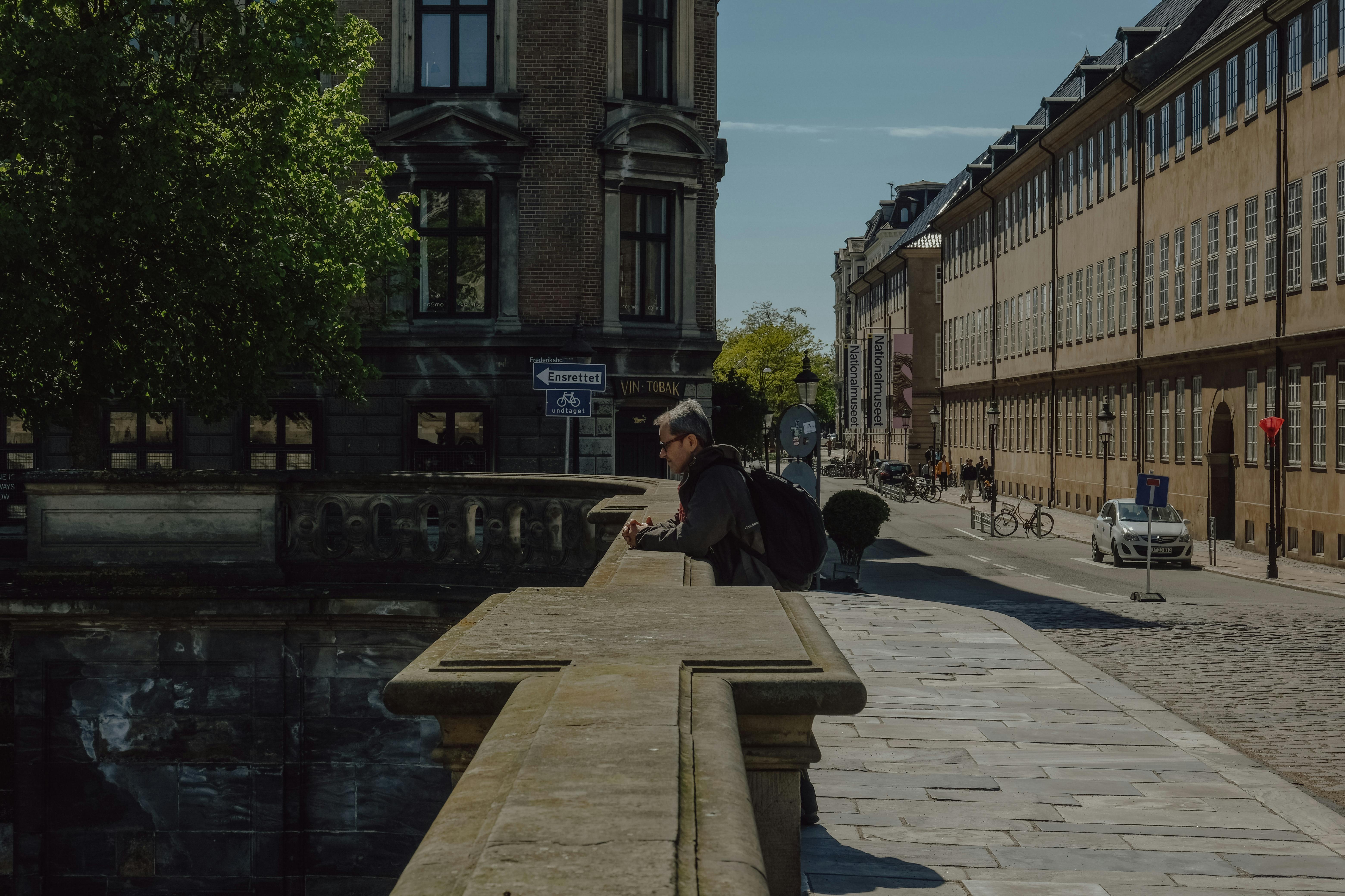 Street View with Man on Bridge in Urban Setting · Free Stock Photo