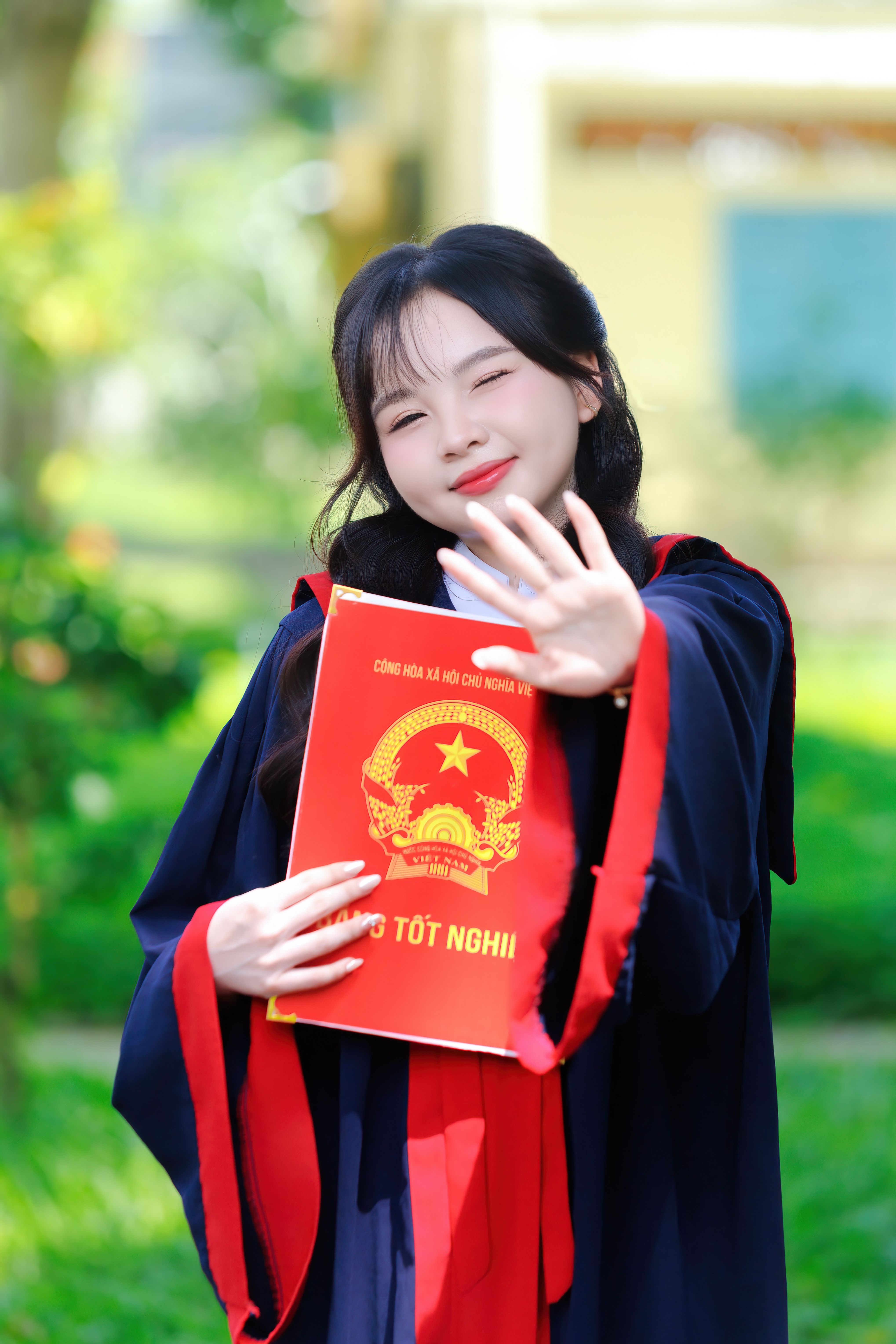 Graduation Portrait of Student with Diploma · Free Stock Photo