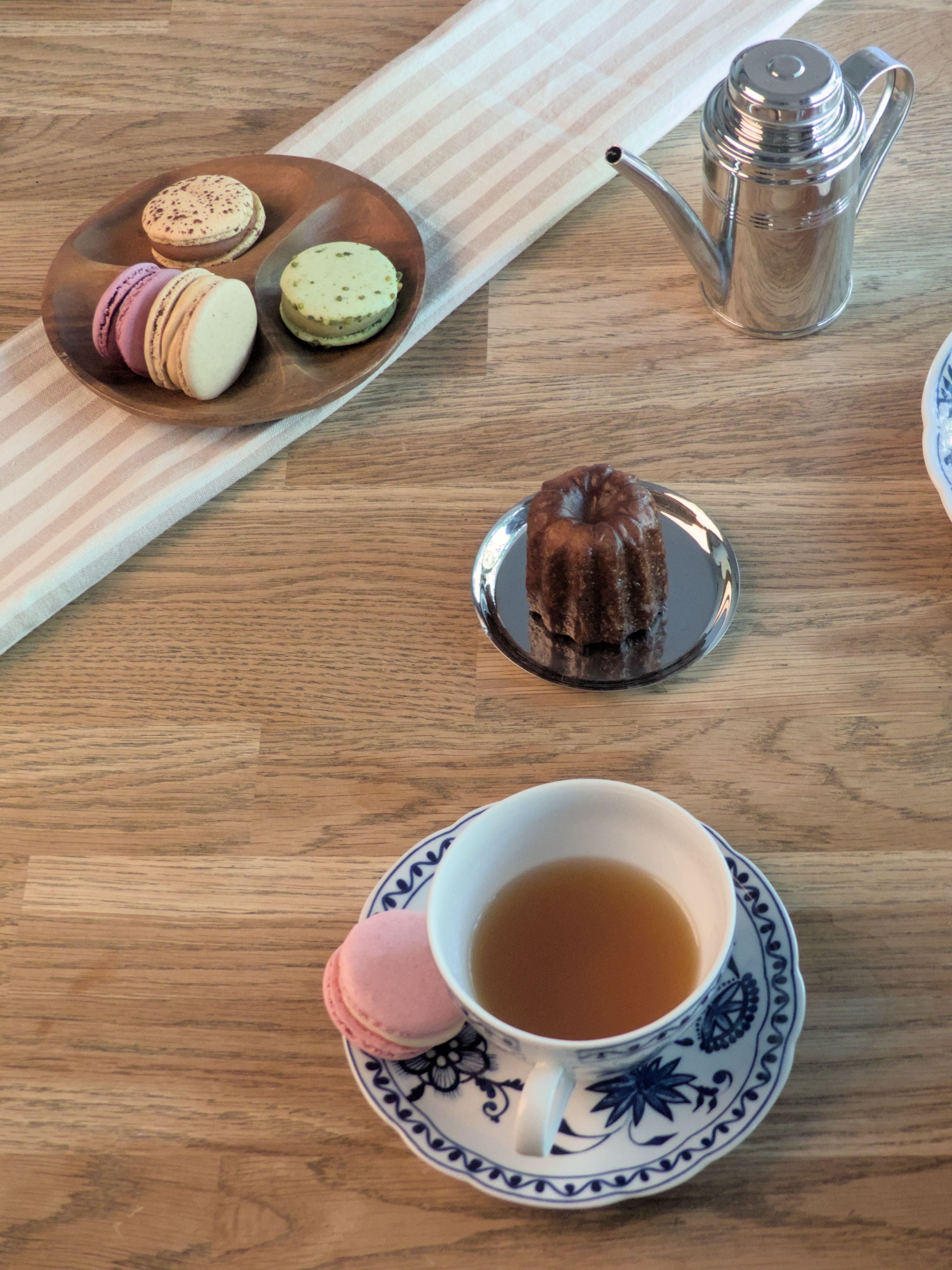 French Tea Time with Macarons and Canelé · Free Stock Photo