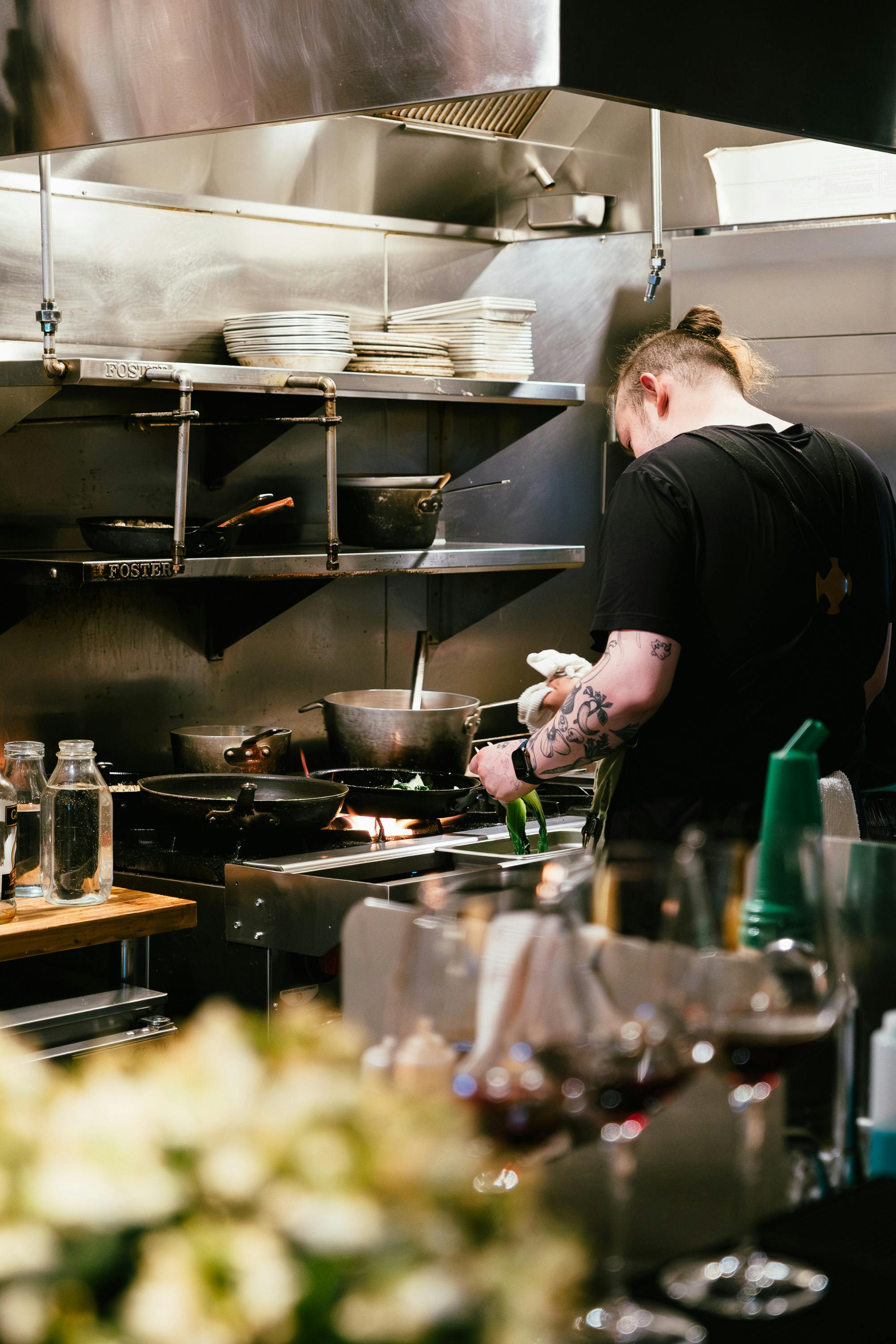 Busy Chef Cooking in a Professional Kitchen · Free Stock Photo