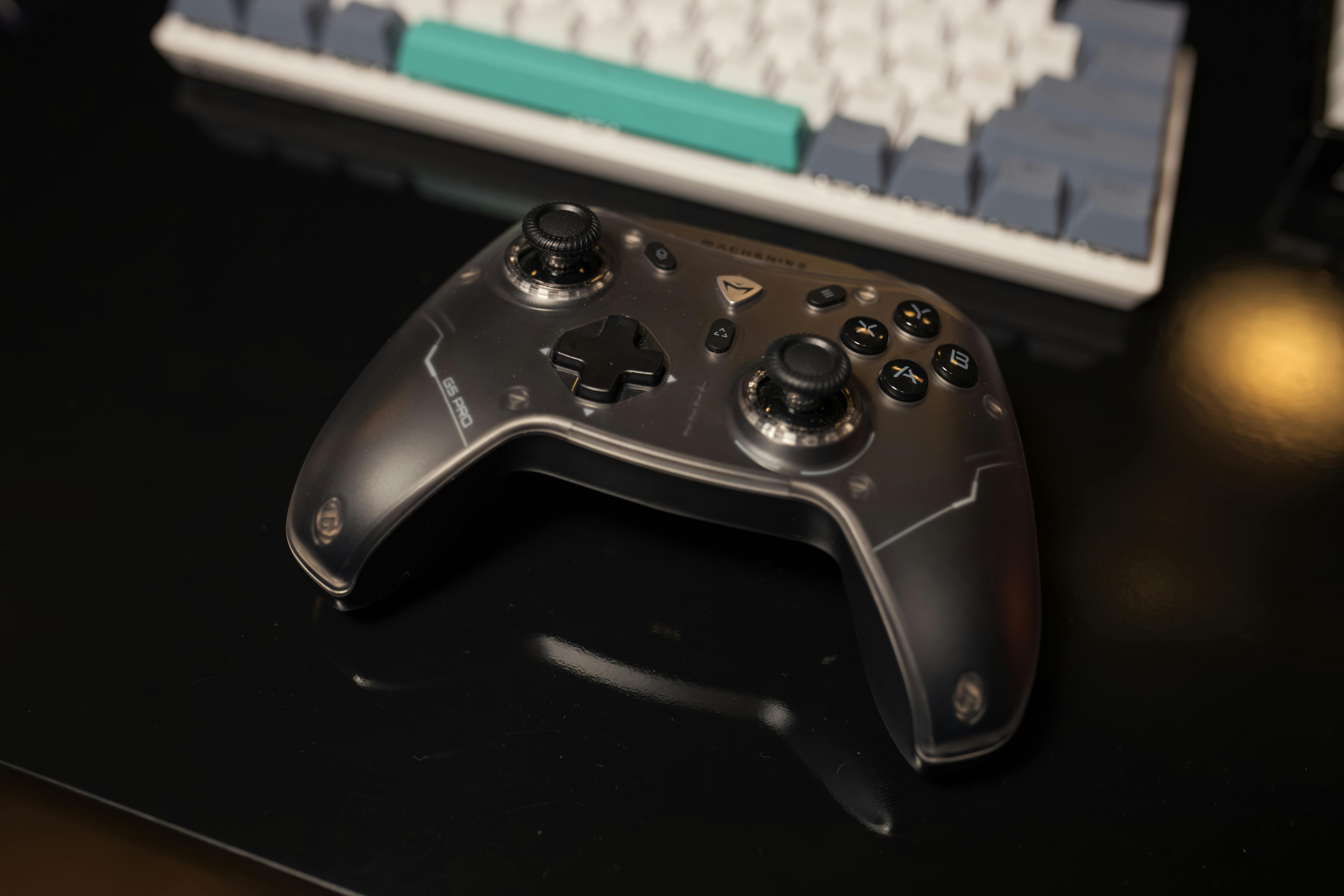 Modern Gaming Controller on Desk with Keyboard · Free Stock Photo