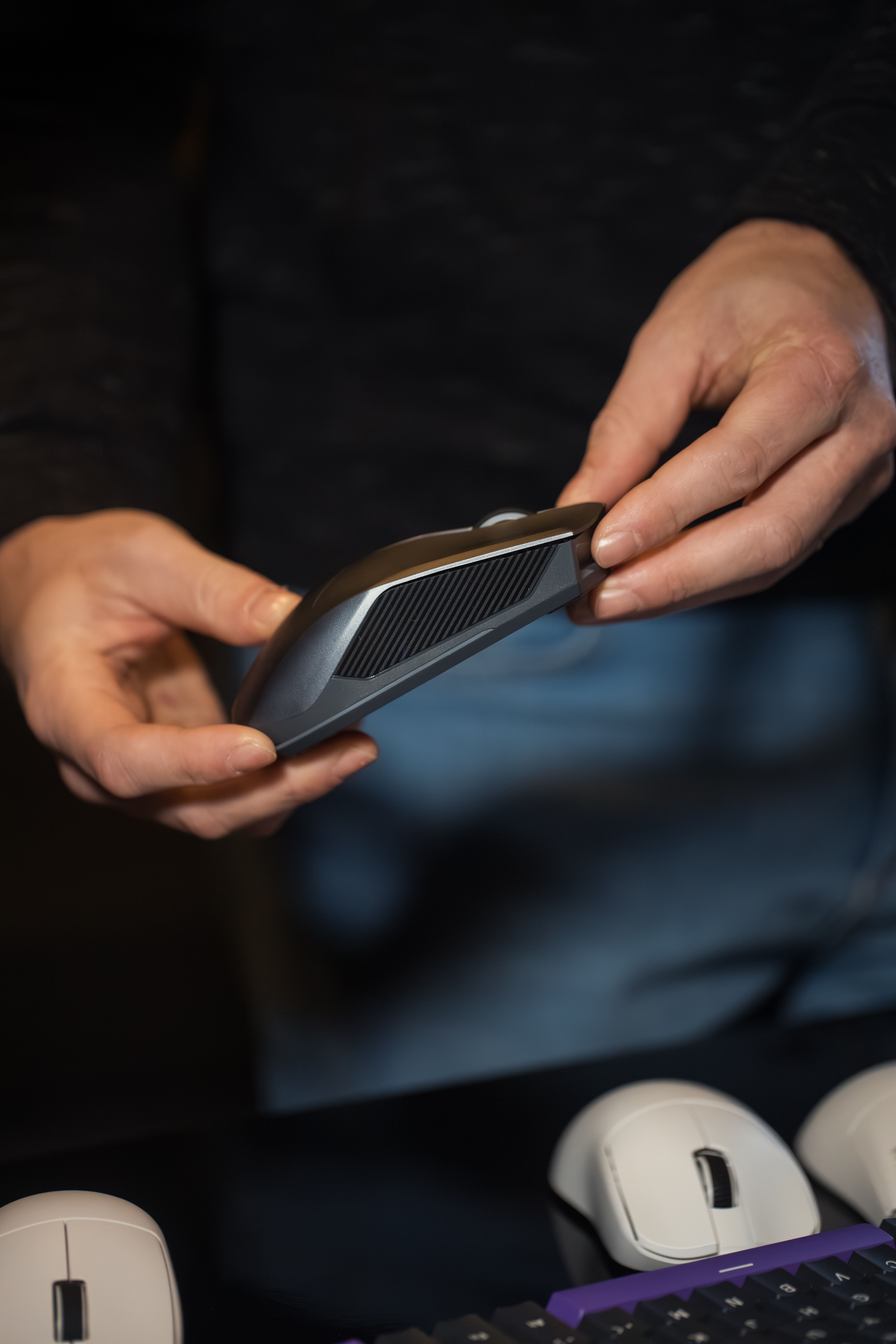 Person Holding Ergonomic Wireless Mouse in Hand · Free Stock Photo