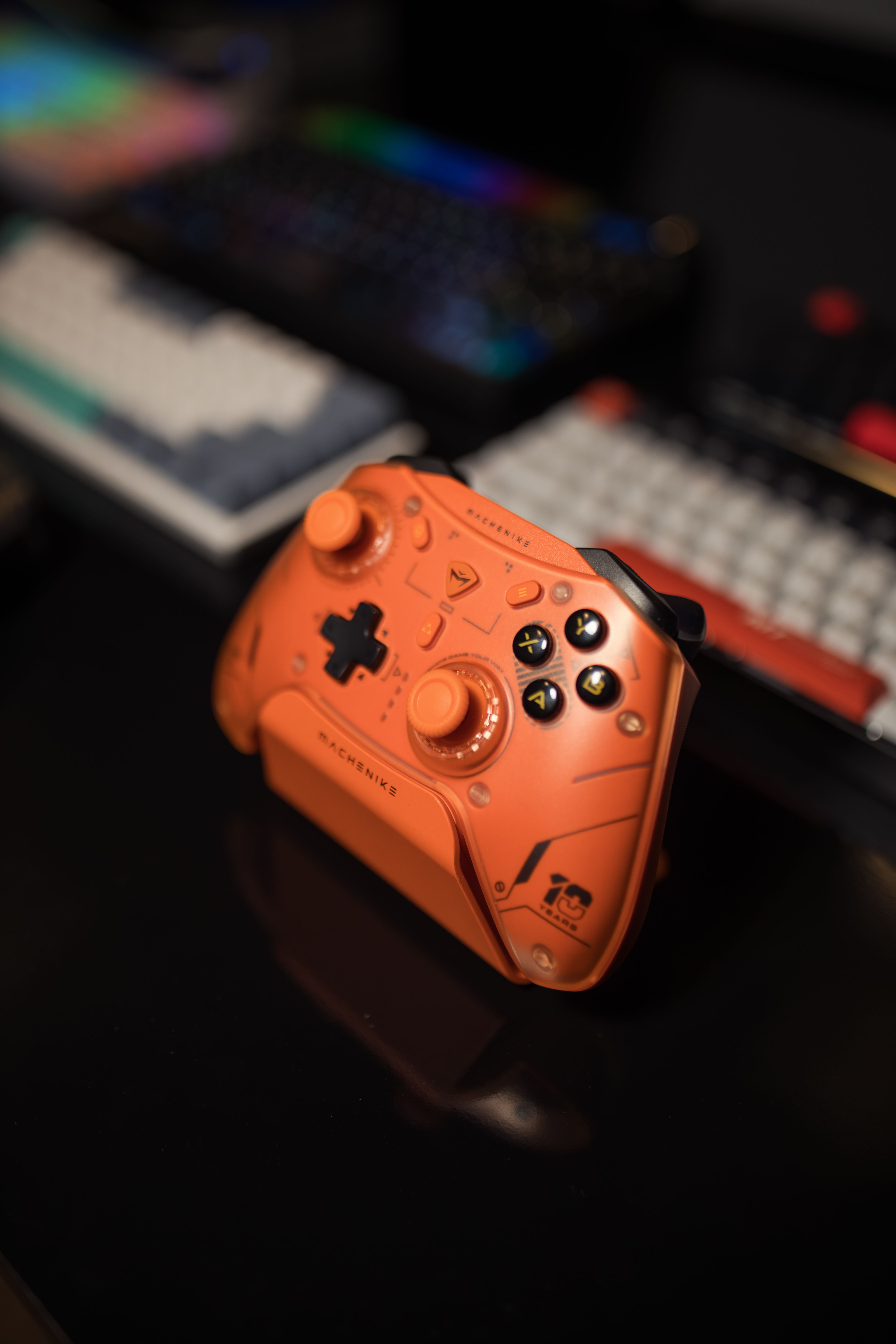 Vibrant Orange Gaming Controller in Modern Setup · Free Stock Photo