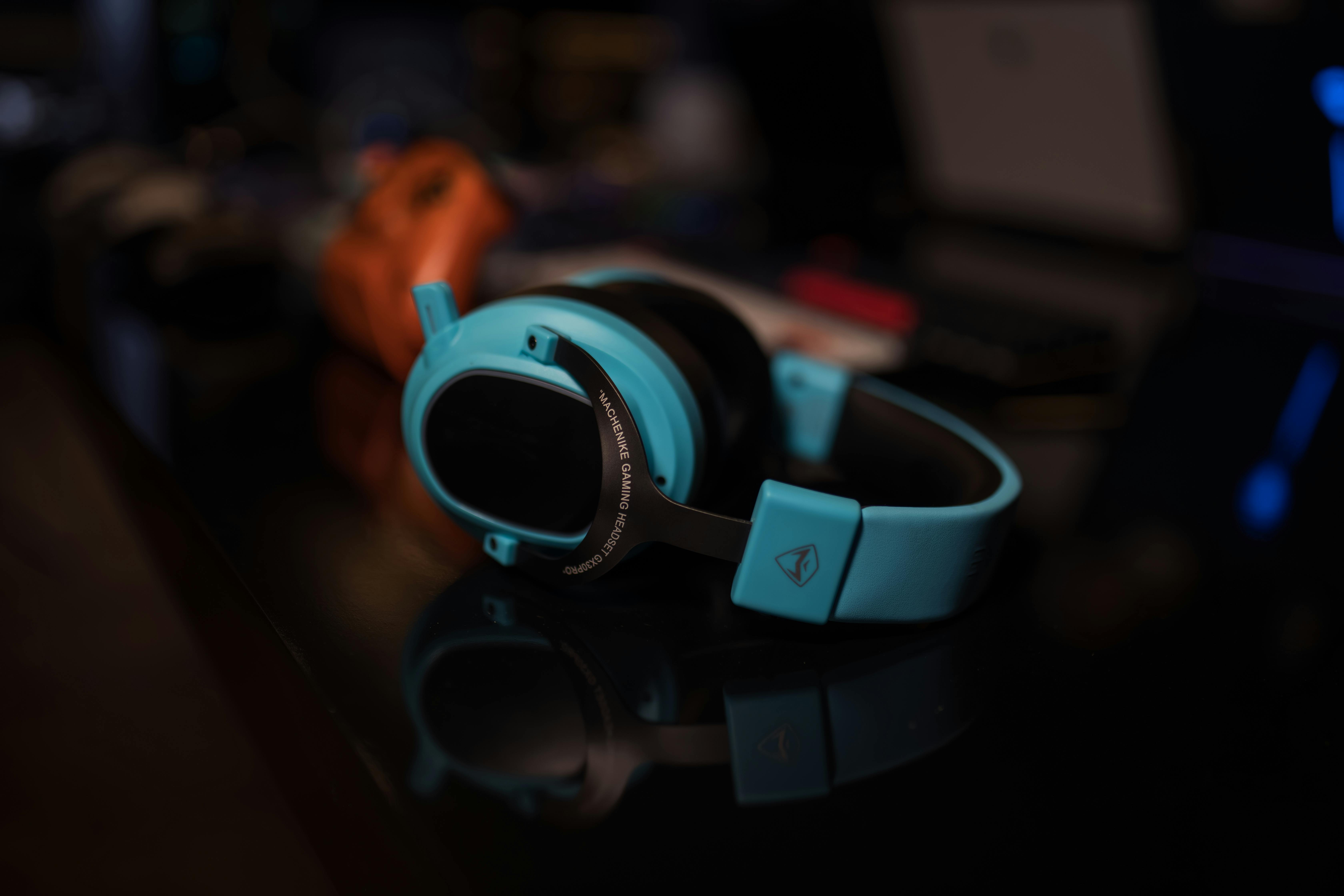 Vibrant Blue Gaming Headset on Reflection · Free Stock Photo