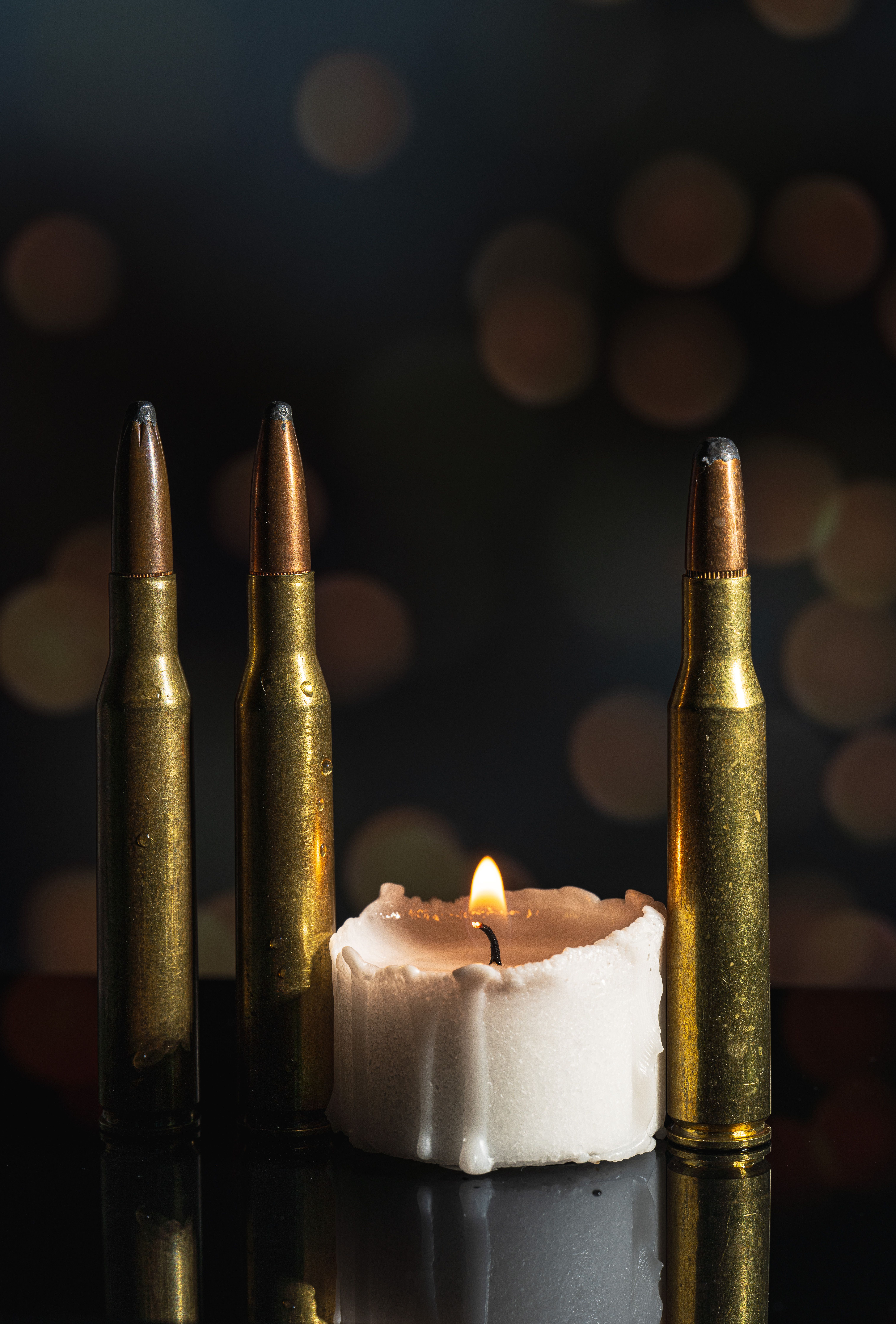 Candlelight and Bullets: Symbolic Still Life · Free Stock Photo